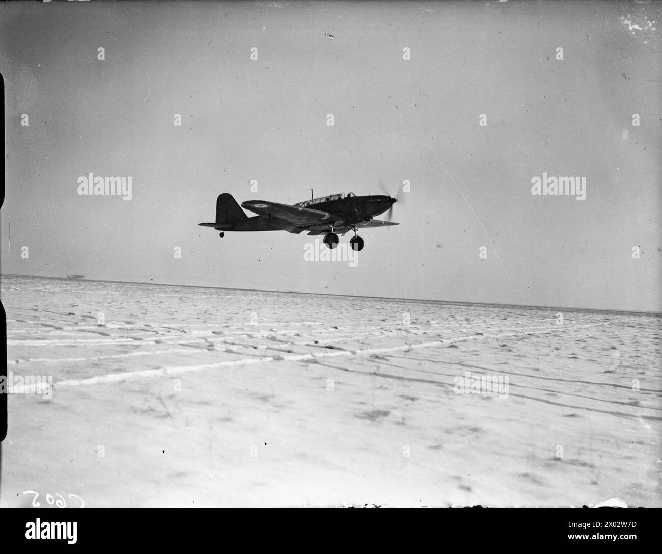 A Fairey Battle of No. 226 Squadron RAF takes off from a snow-covered ...