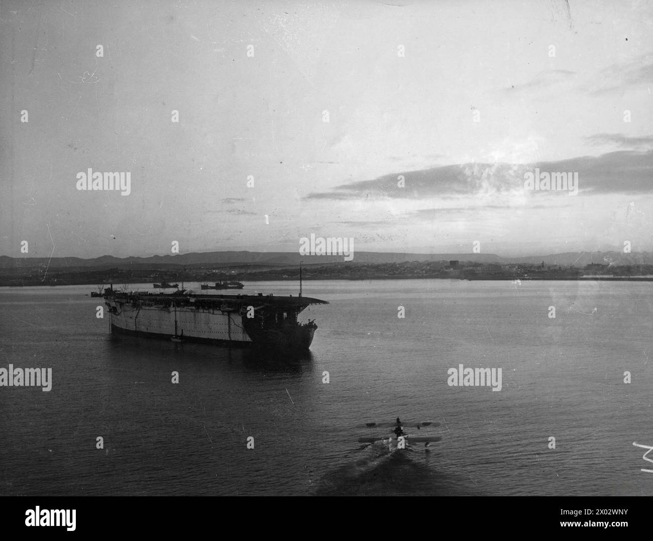 HMS Argus, an aircraft carrier, was at anchor in 1940 while a ...