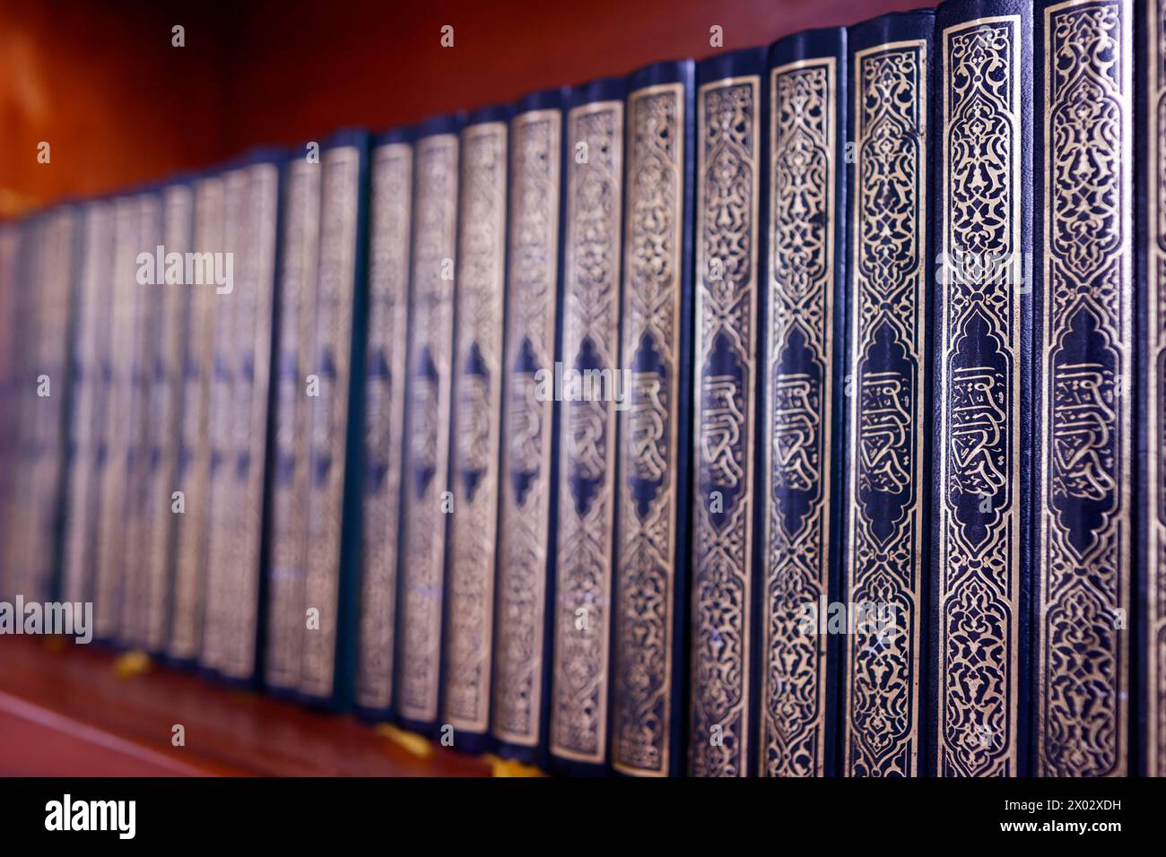 Row of Holy Quran (Koran) books in a mosque, Islamic symbol, Phnom Penh ...