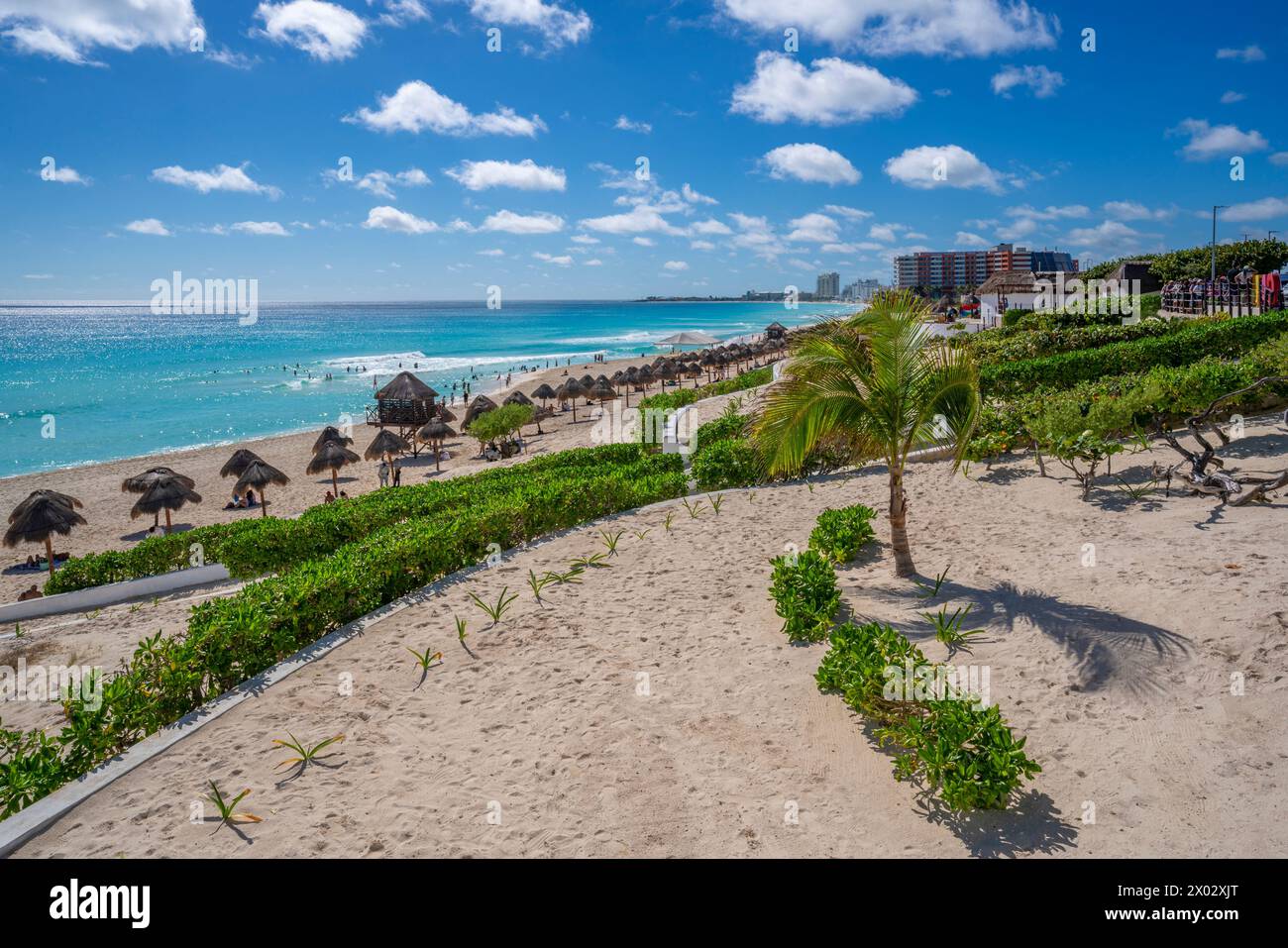 View of long white sandy beach at Playa Delfines, Hotel Zone, Cancun ...