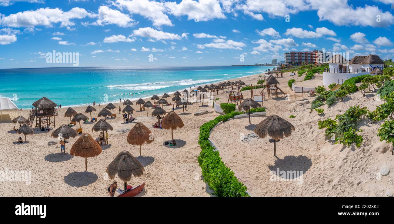 View of long white sandy beach at Playa Delfines, Hotel Zone, Cancun ...
