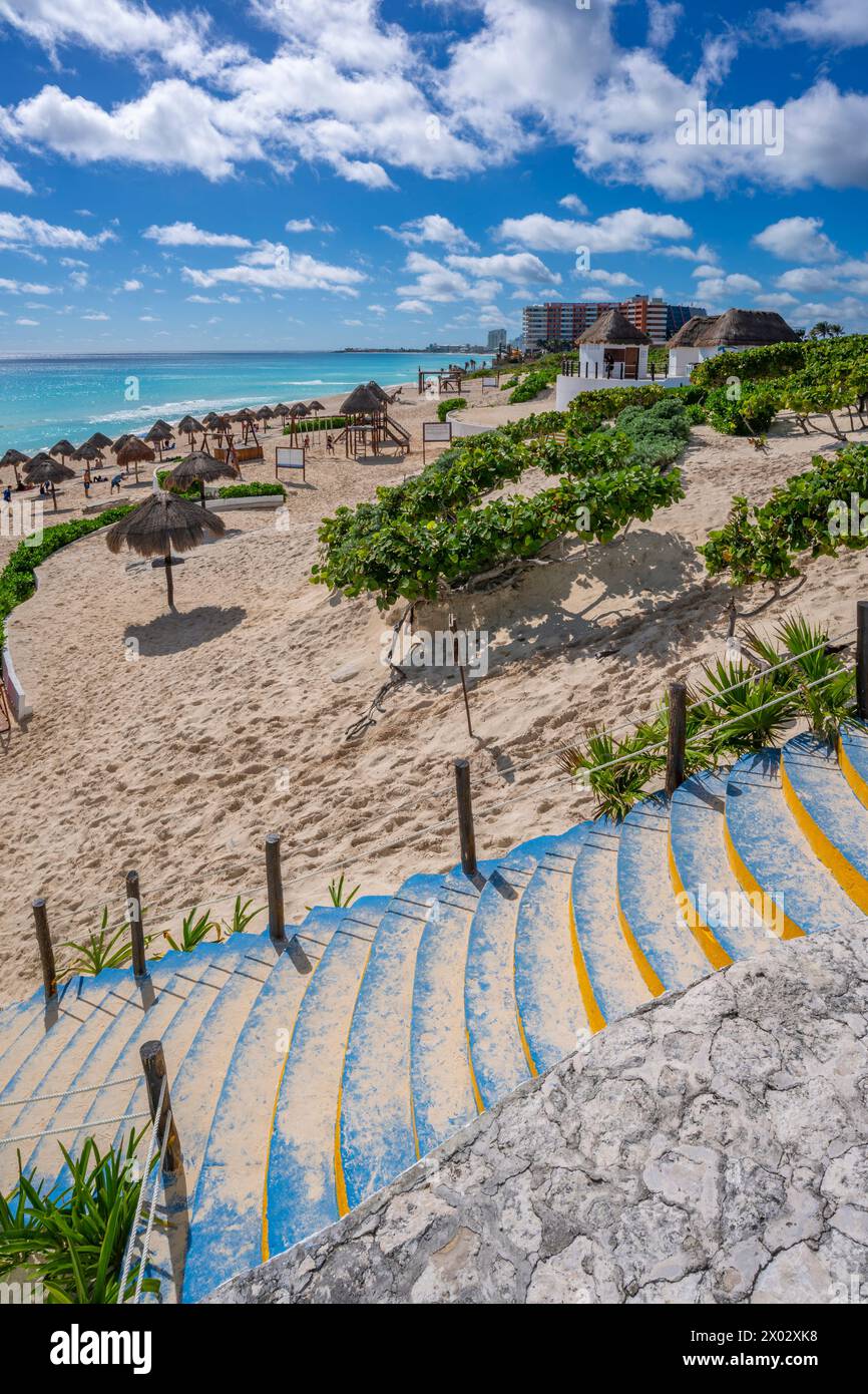 View of long white sandy beach at Playa Delfines, Hotel Zone, Cancun ...