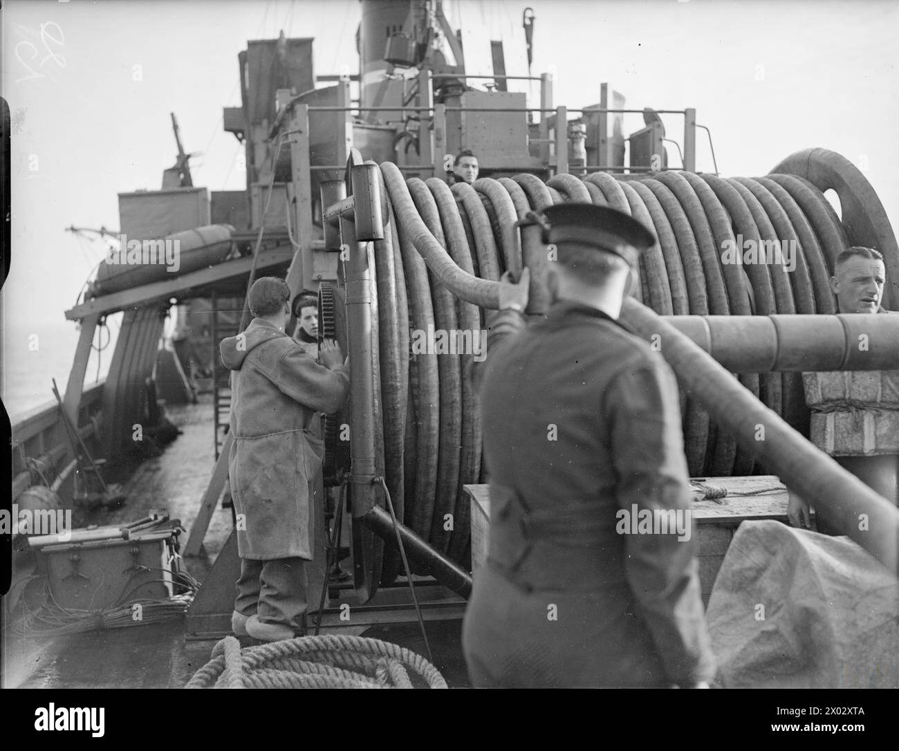 Crew members of HM Minesweeper 1023 operated the LL sweeping gear to ...