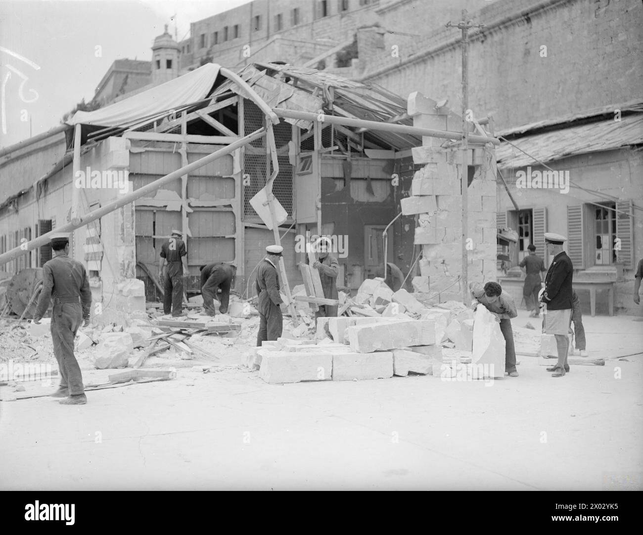 BOMB DAMAGE FROM THE RENEWED BLITZ ON MALTA. 5 MAY 1942, MALTA. - Naval ...