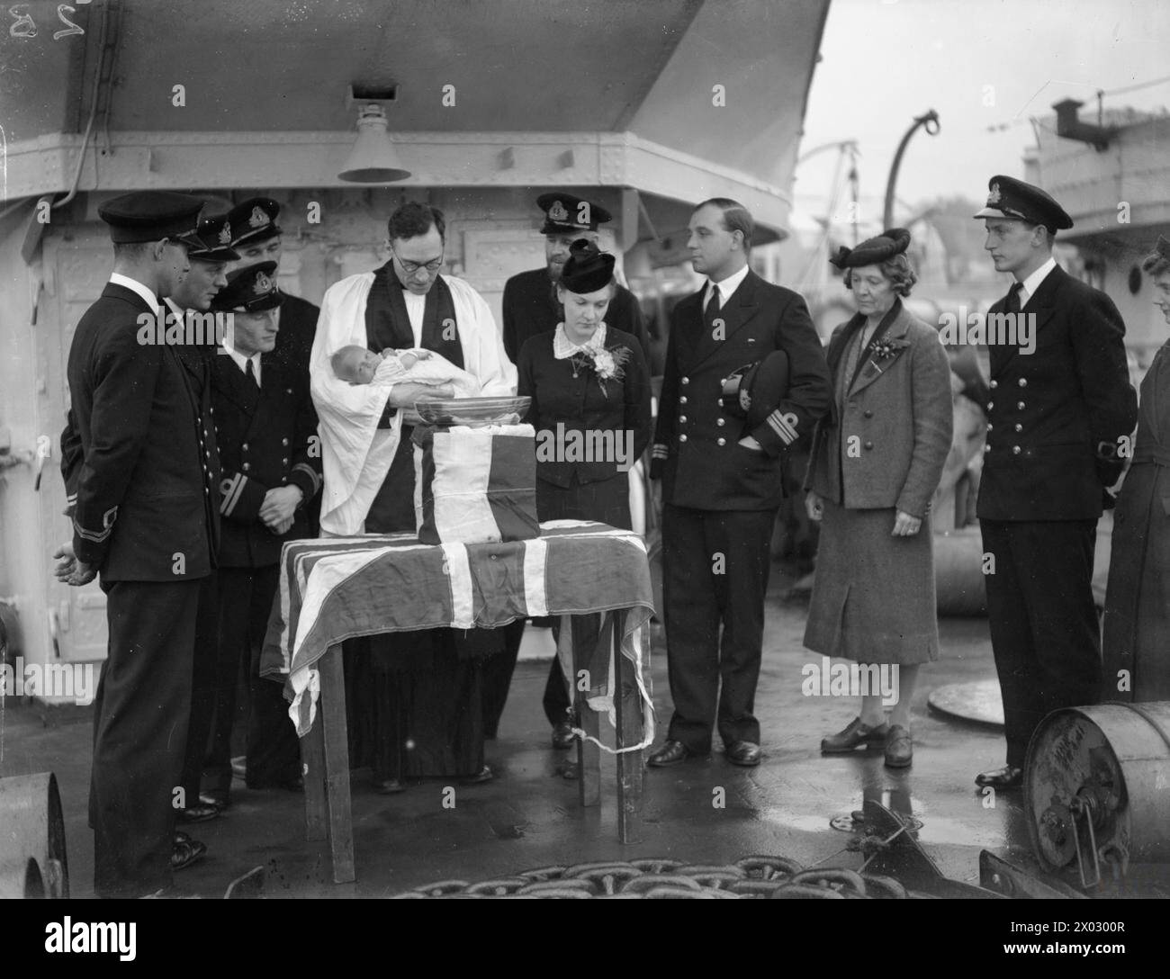 CHRISTENING ON BOARD THE DESTROYER HMS AMAZON. OCTOBER 1941. DURING A ...