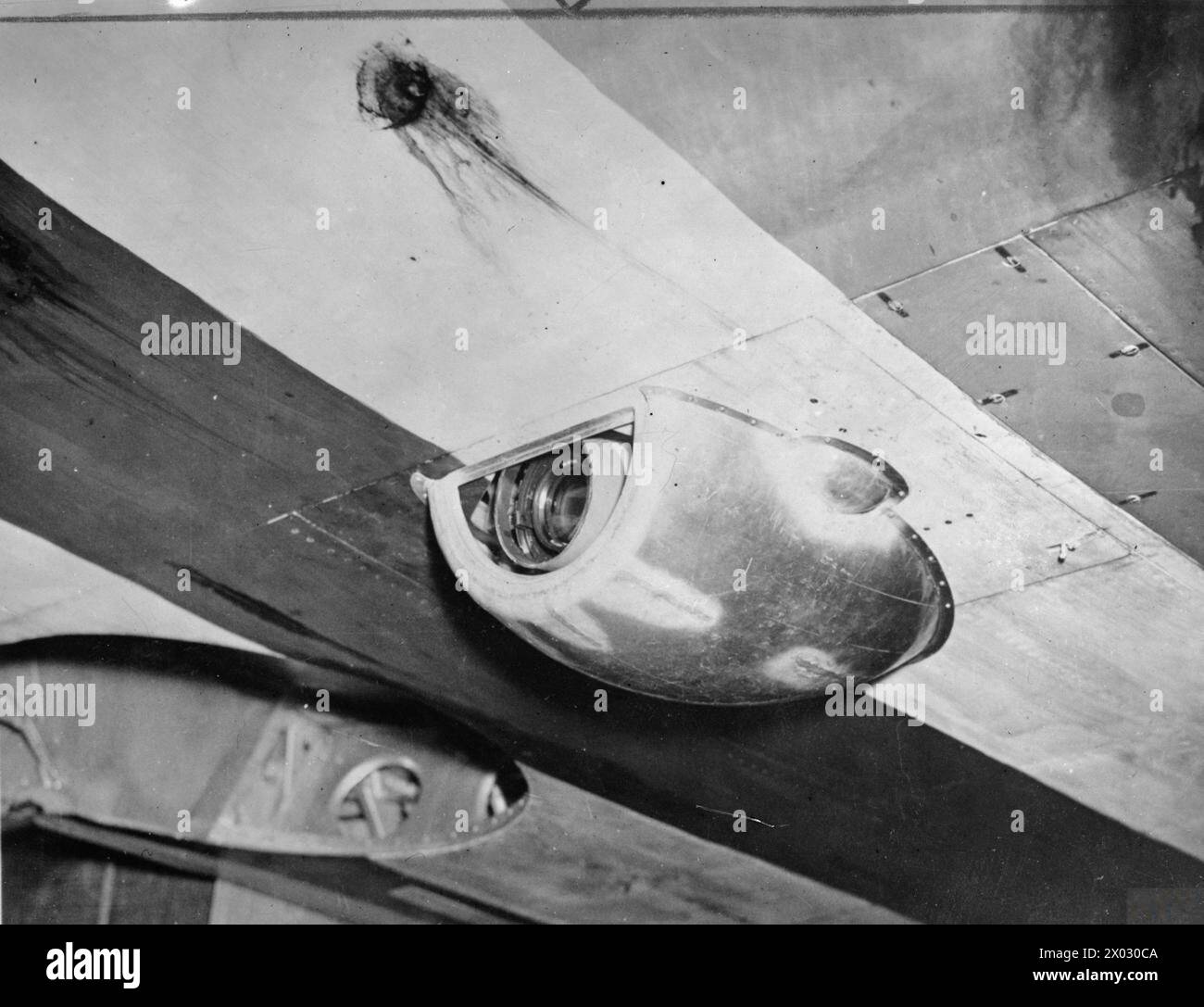 An F.24 aerial camera with an 8-inch focal-length lens is installed ...