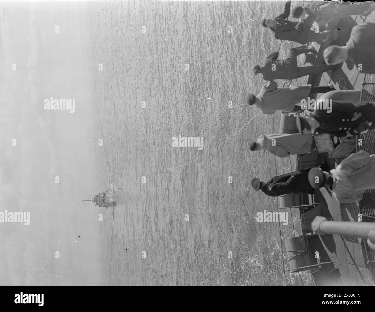 OILING AT SEA TRIALS WITH NEW TYPE RUBBER HOSE (FLOATING). 1942, ON ...