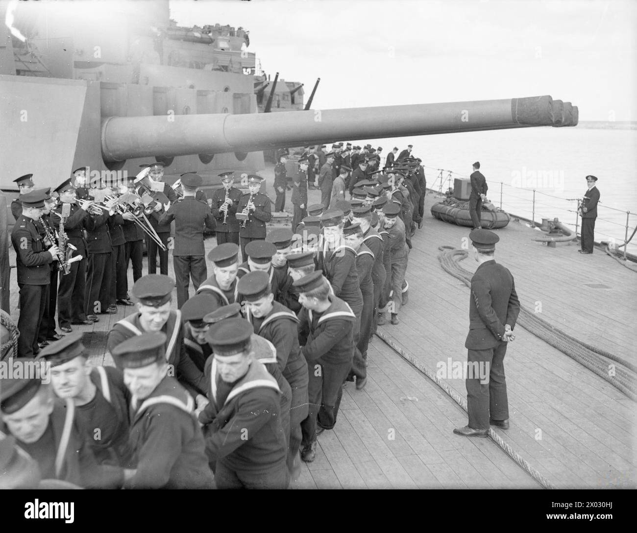 HMS Prince of Wales, a British battleship, conducts a tow preparation ...