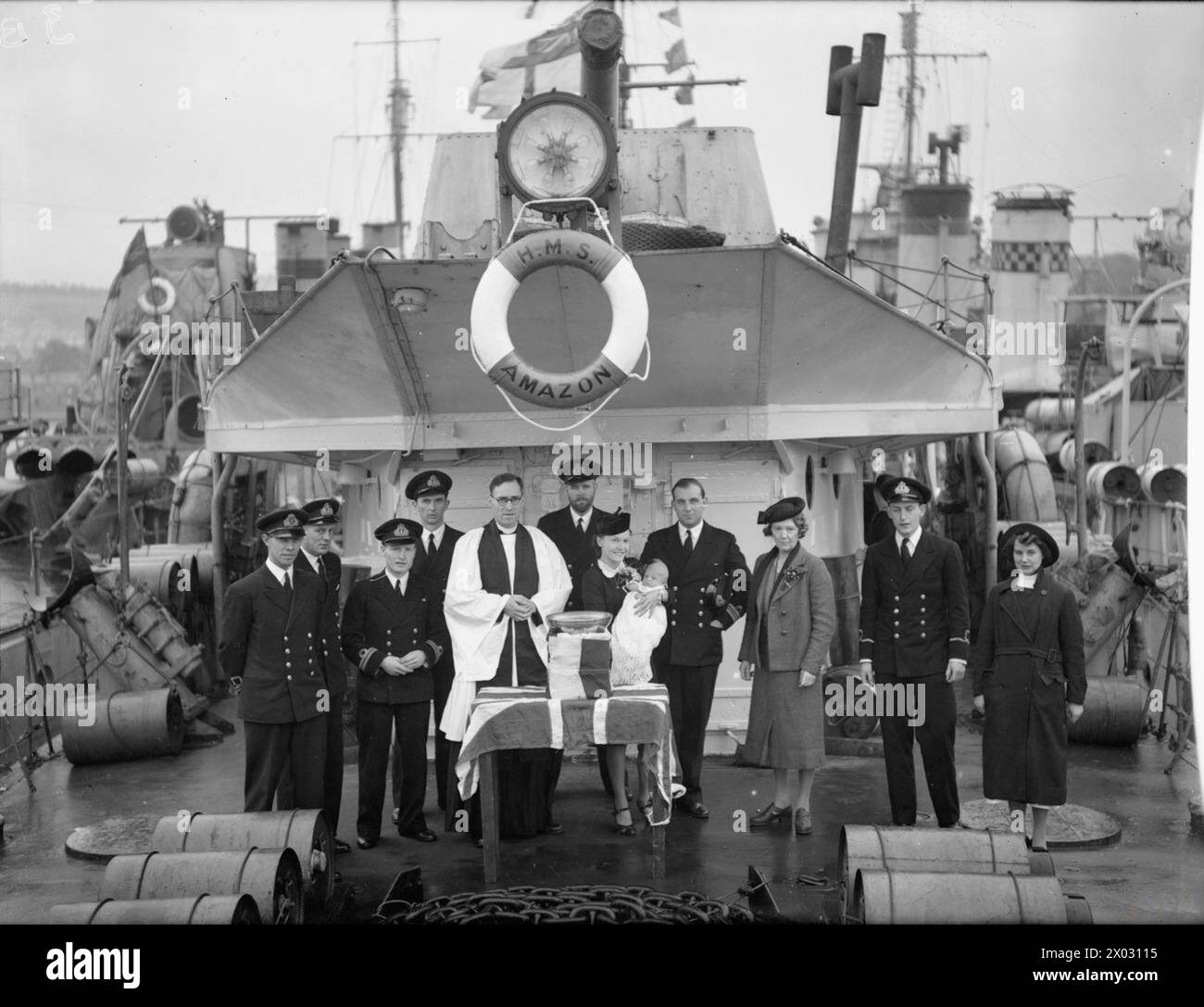 CHRISTENING ON BOARD THE DESTROYER HMS AMAZON. OCTOBER 1941. DURING A ...