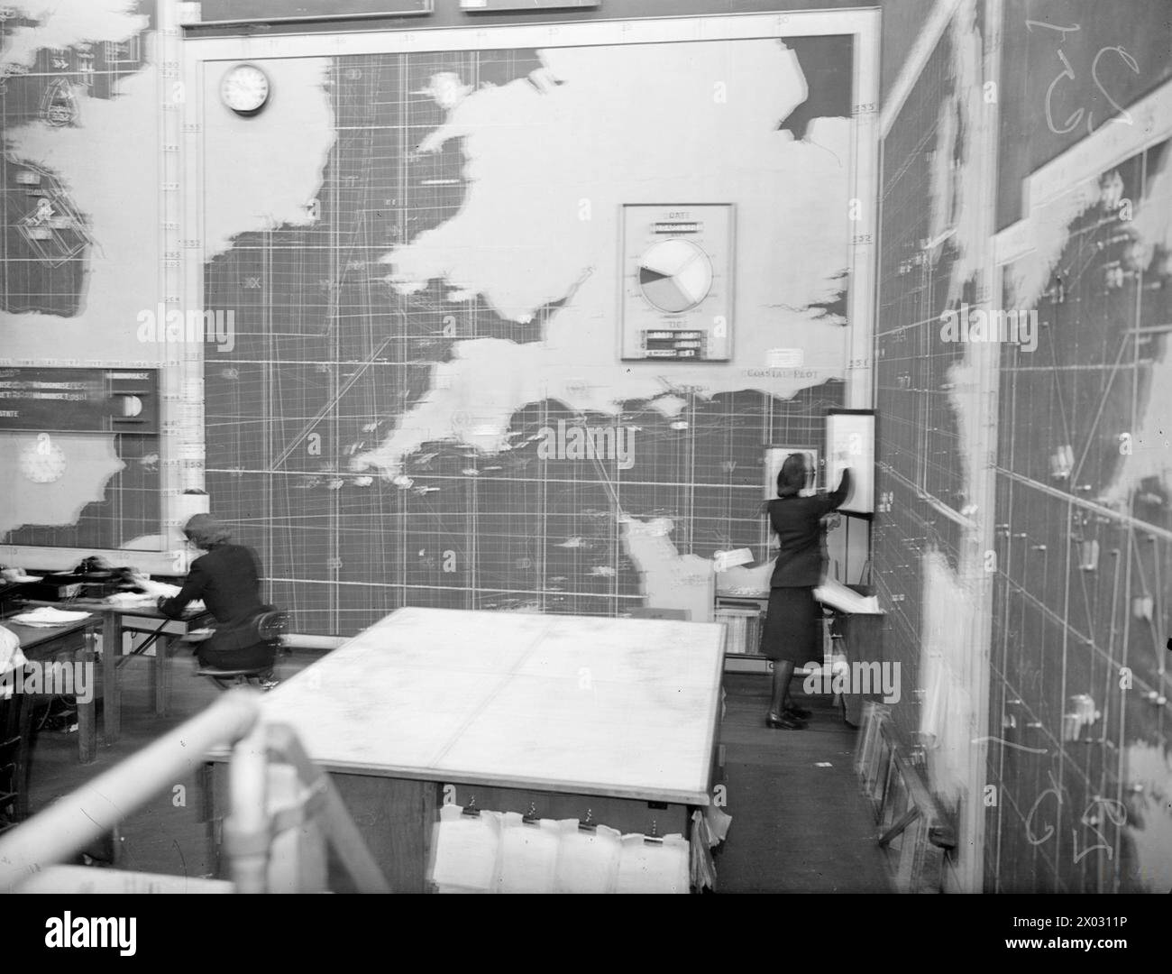 On 20 April 1945, naval officers conduct plotting operations in the ...