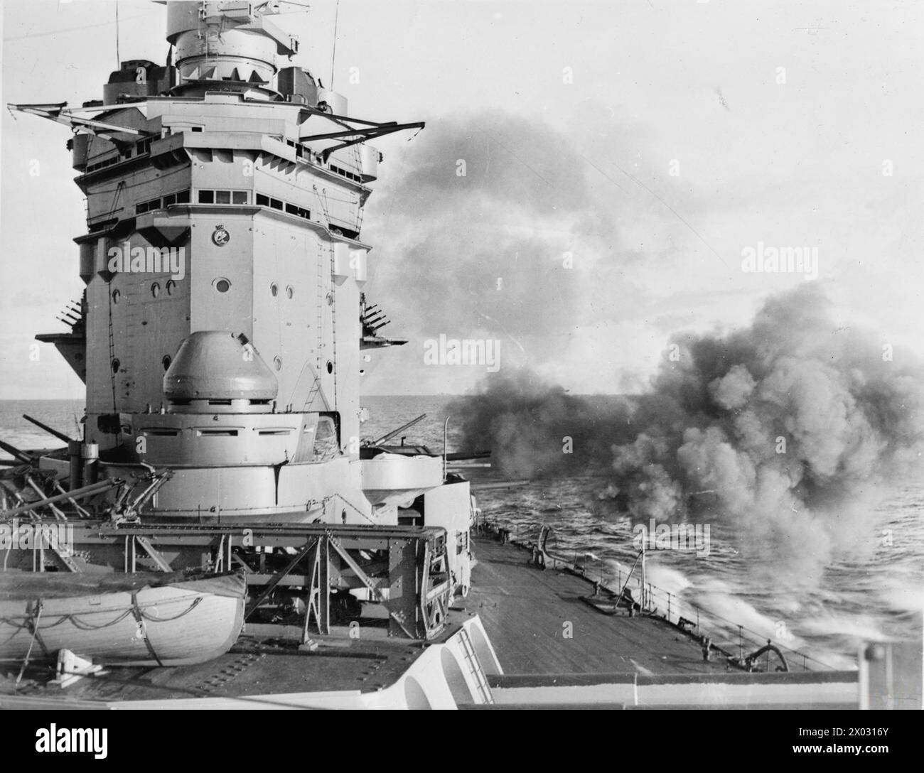 ON BOARD THE BATTLESHIP HMS RODNEY AT SEA. 1940. - HMS RODNEY firing ...