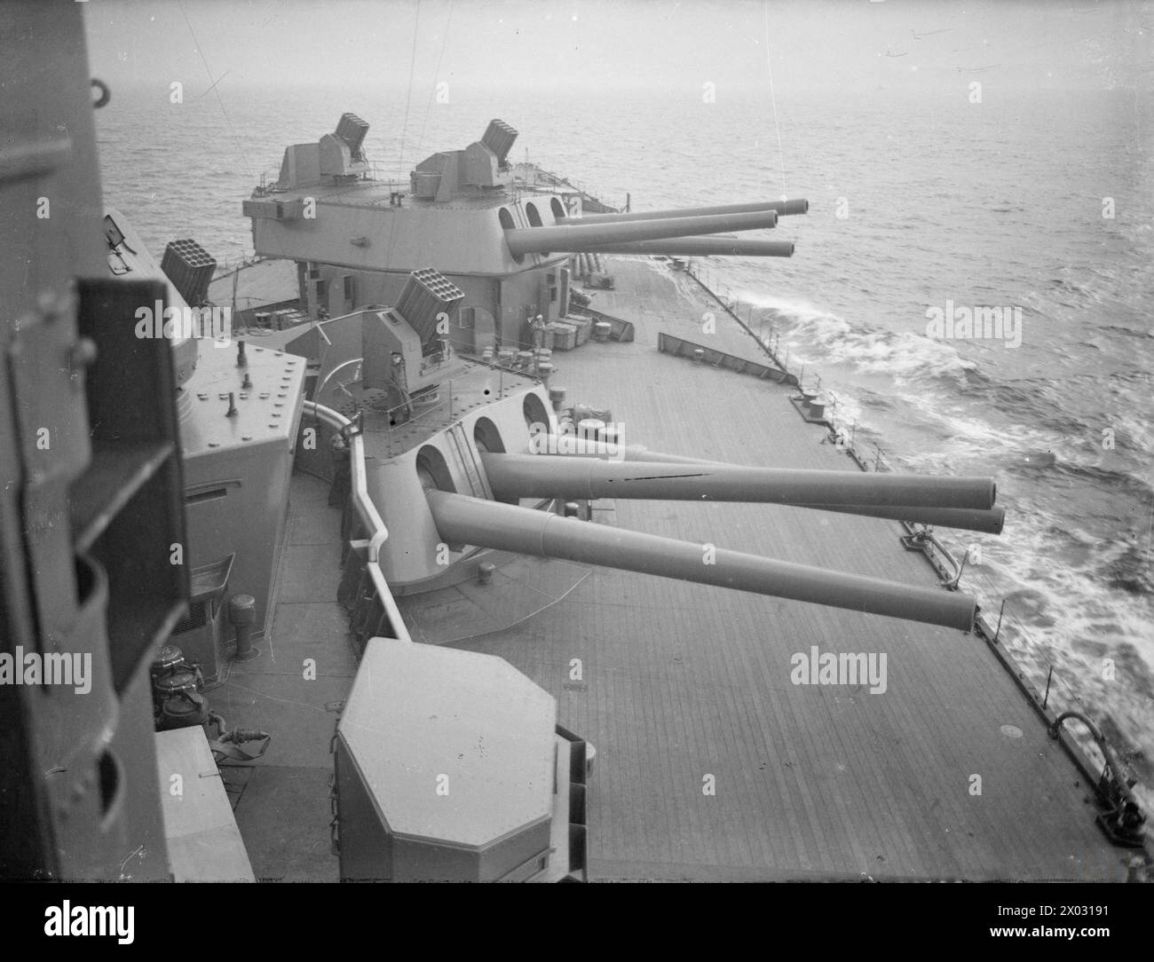 ON BOARD THE BATTLESHIP HMS NELSON AT SEA. 1940. - Looking forward from ...