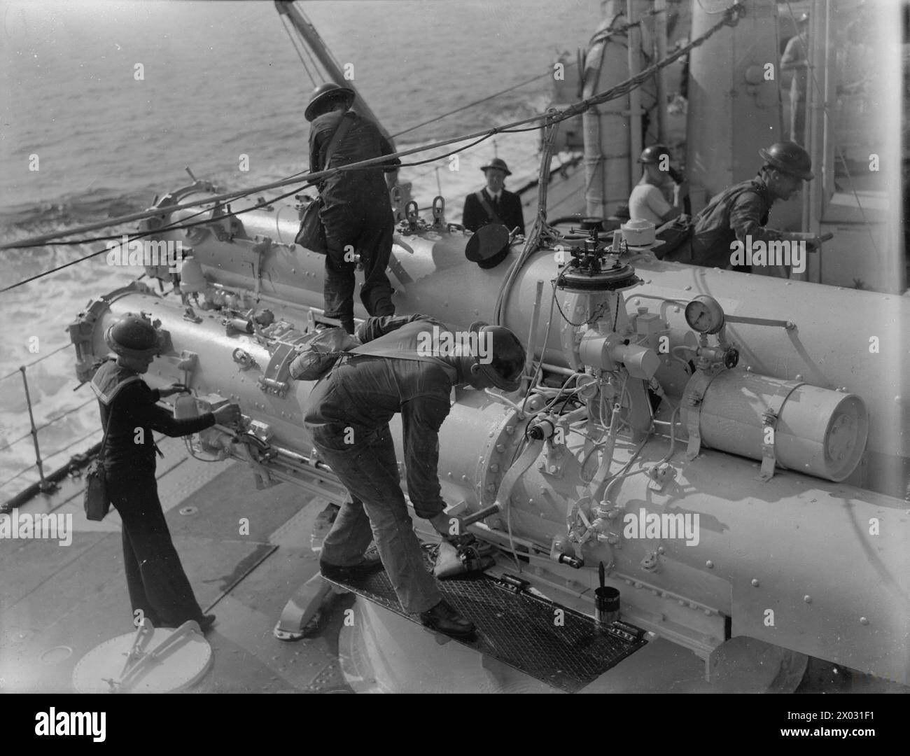 In September 1940, HMS Broke destroyer crews manned torpedo tubes at ...