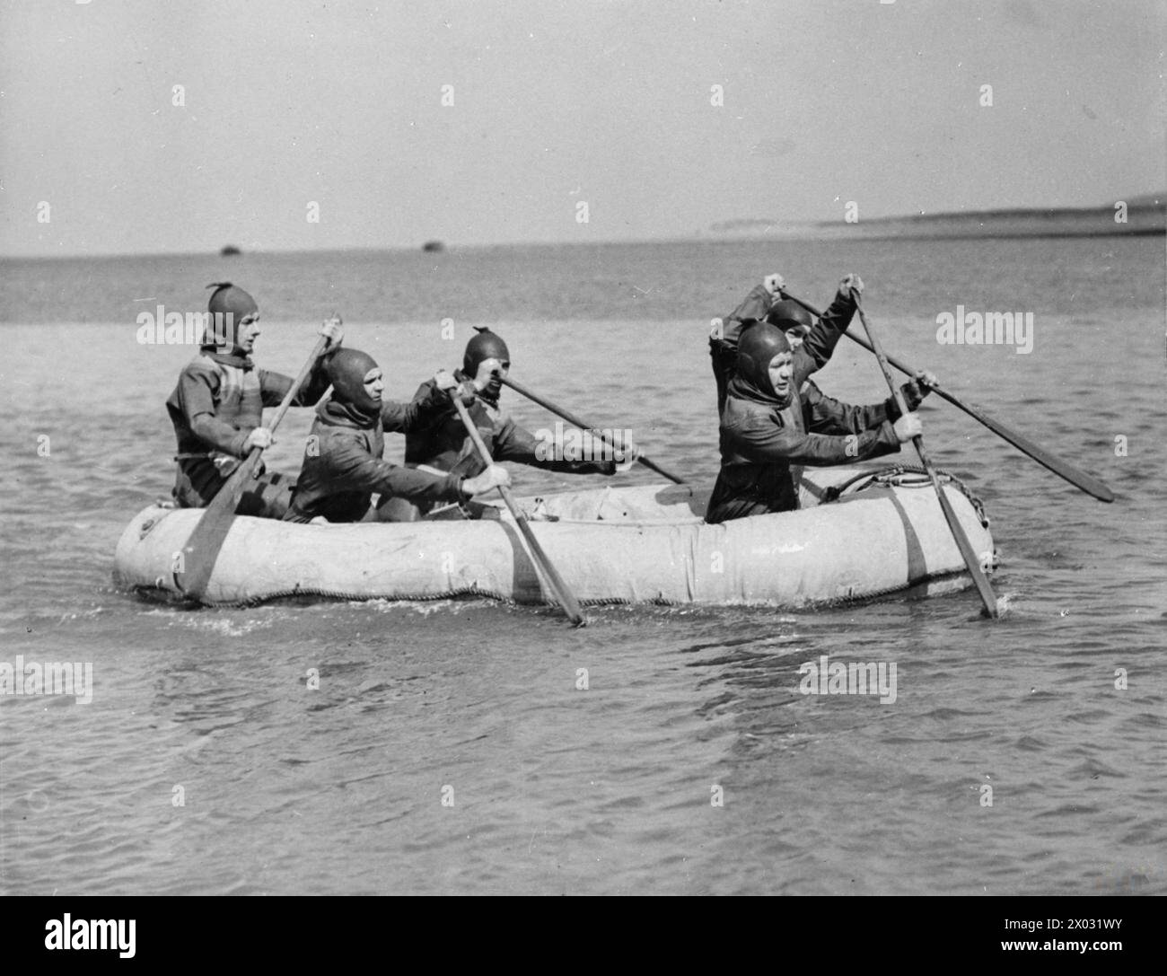 THE ROYAL NAVY DURING THE SECOND WORLD WAR - Five frogmen paddling one ...