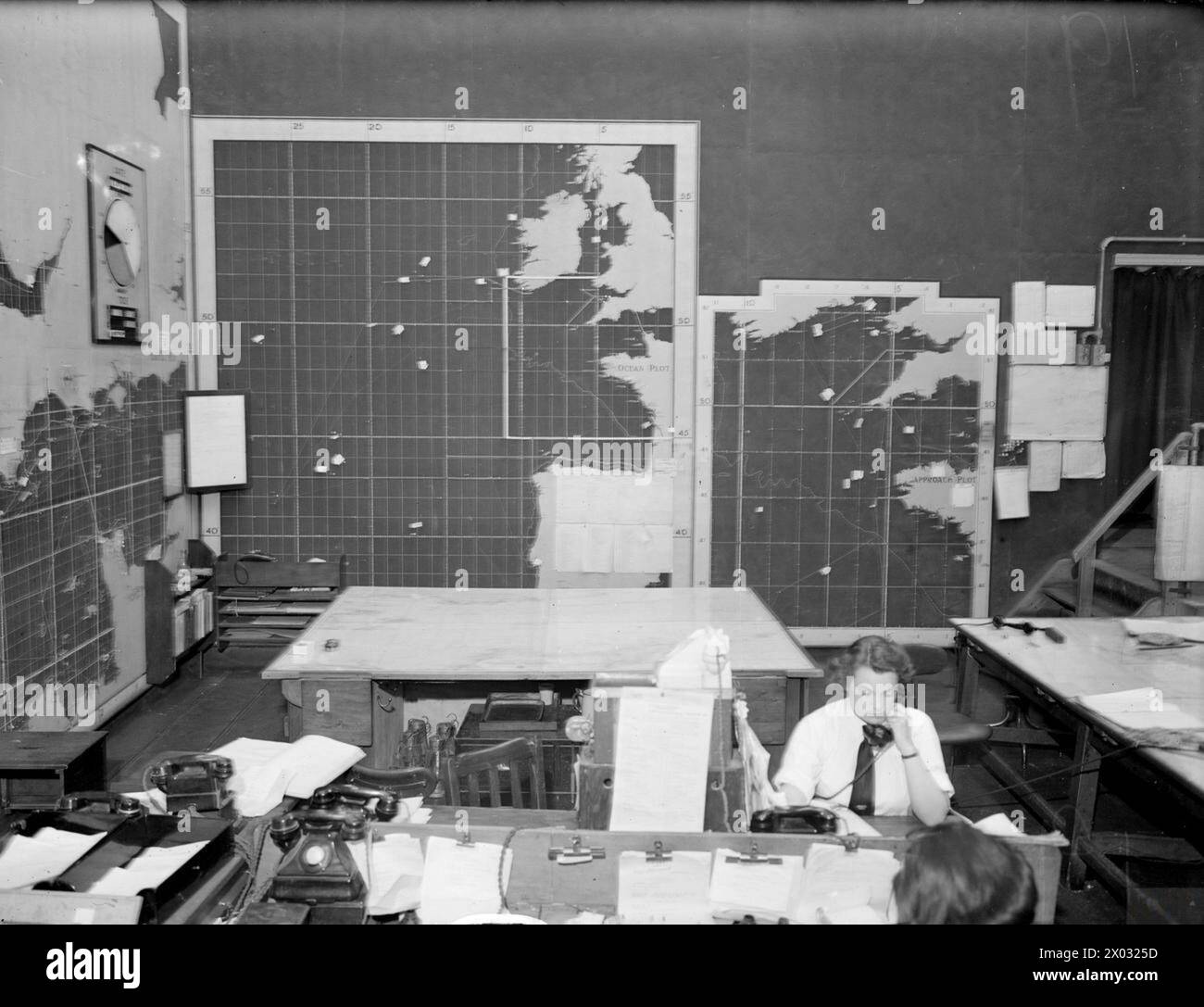 On 20 April 1945, naval officers and crew conducted plotting operations ...