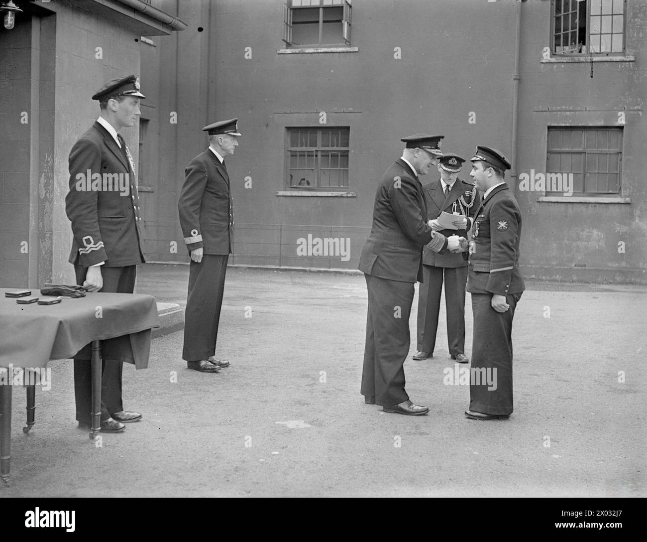 Admiral Sir Wm J Whitworth decorates officers and crew of the French ...