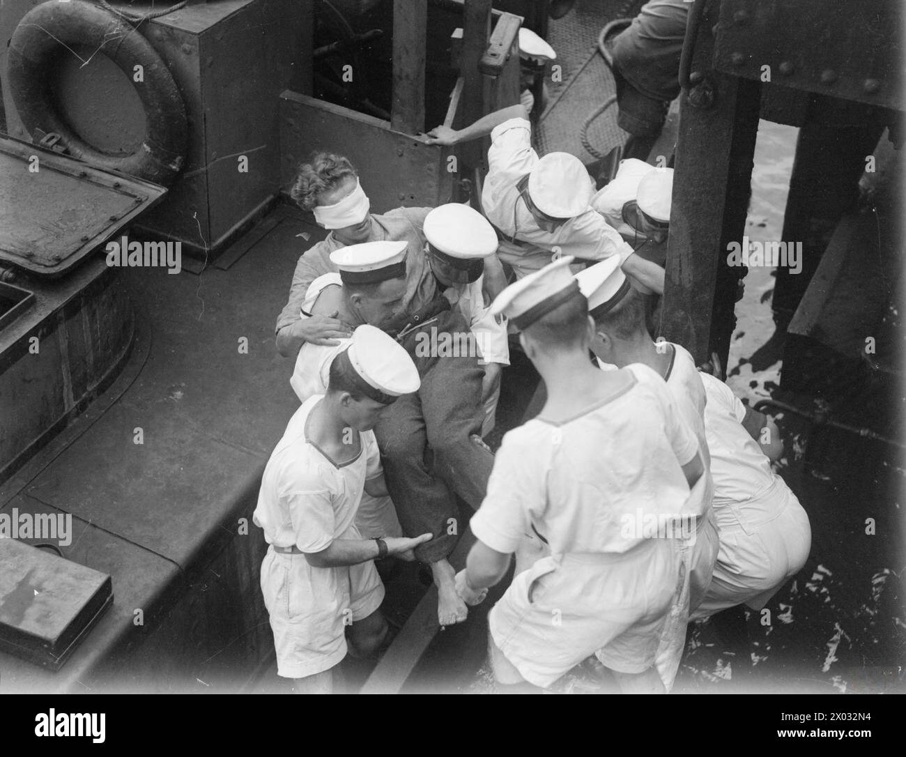 HMS CLARKIA PICKS UP SURVIVORS OF U-BOAT SUNK BY BLAZING LIBERATOR BOMBER. OCTOBER 1943 ...