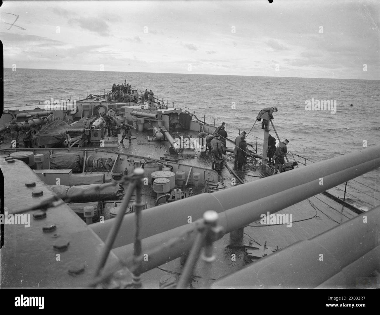 ON BOARD THE BATTLESHIP HMS RODNEY AT SEA. 1940. - Taking down the ...