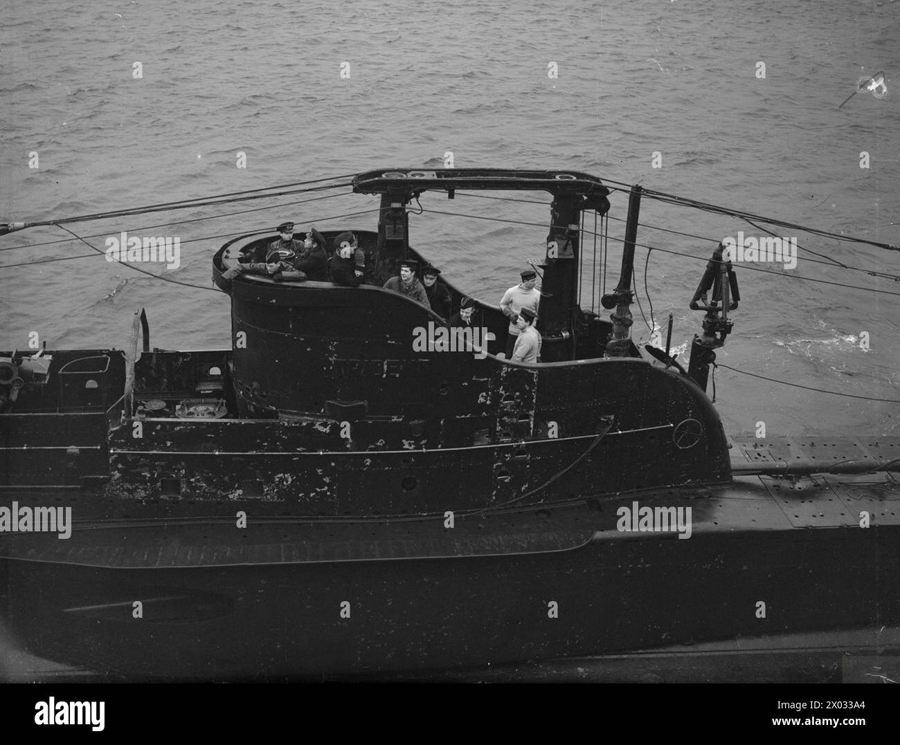 HM Submarine Trident arrives alongside depot ship HMS Forth at Holy ...