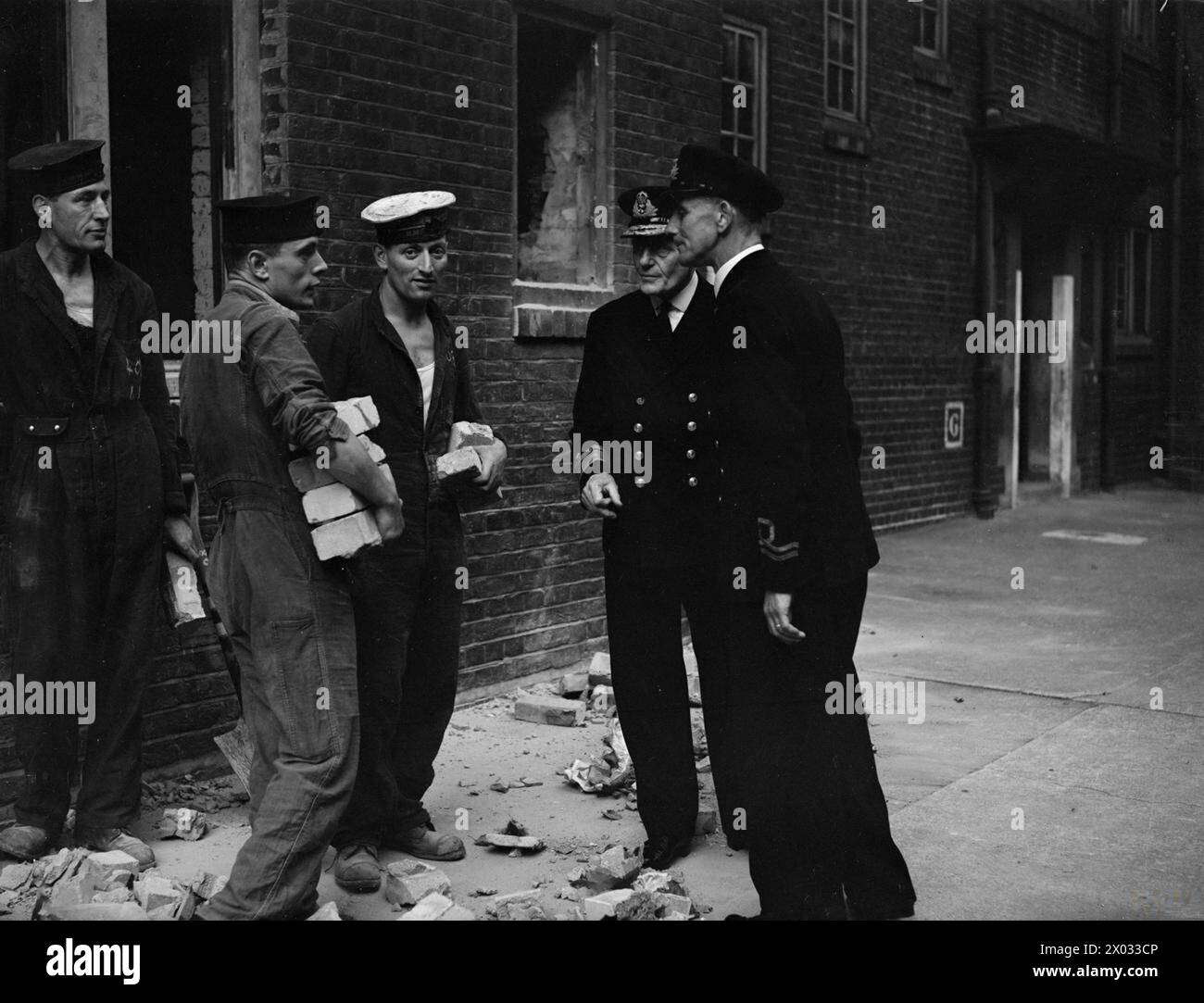 VC ADMIRAL INSPECTS SAILORS REPAIRING LONDON HOUSES. 26 JULY 1945 ...
