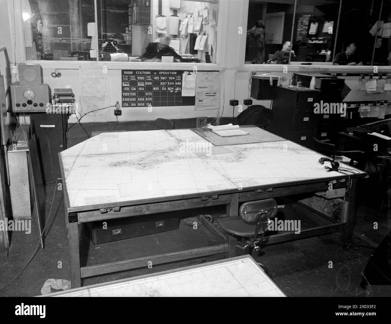 Personnel conduct naval plotting in the plotting room at Plymouth Naval ...