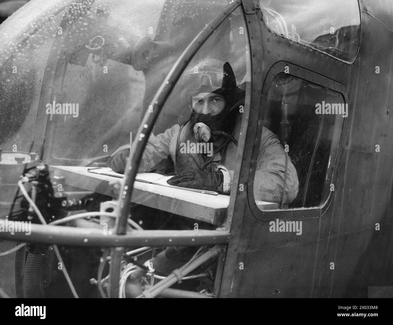 Navigator positioned in the nose of a Handley Page Hampden bomber in ...