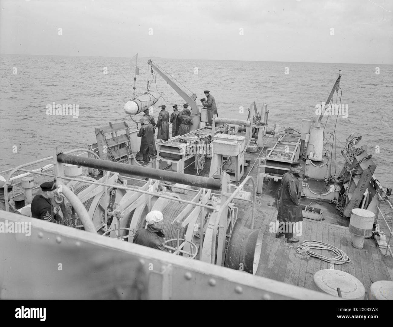 A British Algerine-class minesweeper operates in July 1945 from HMS ...