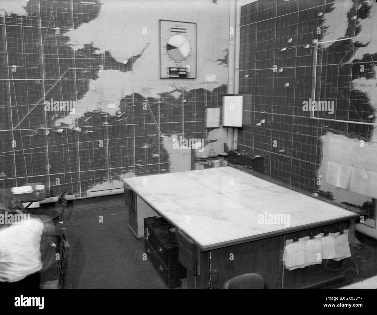 Naval officers conducted plotting operations in the plotting room at ...