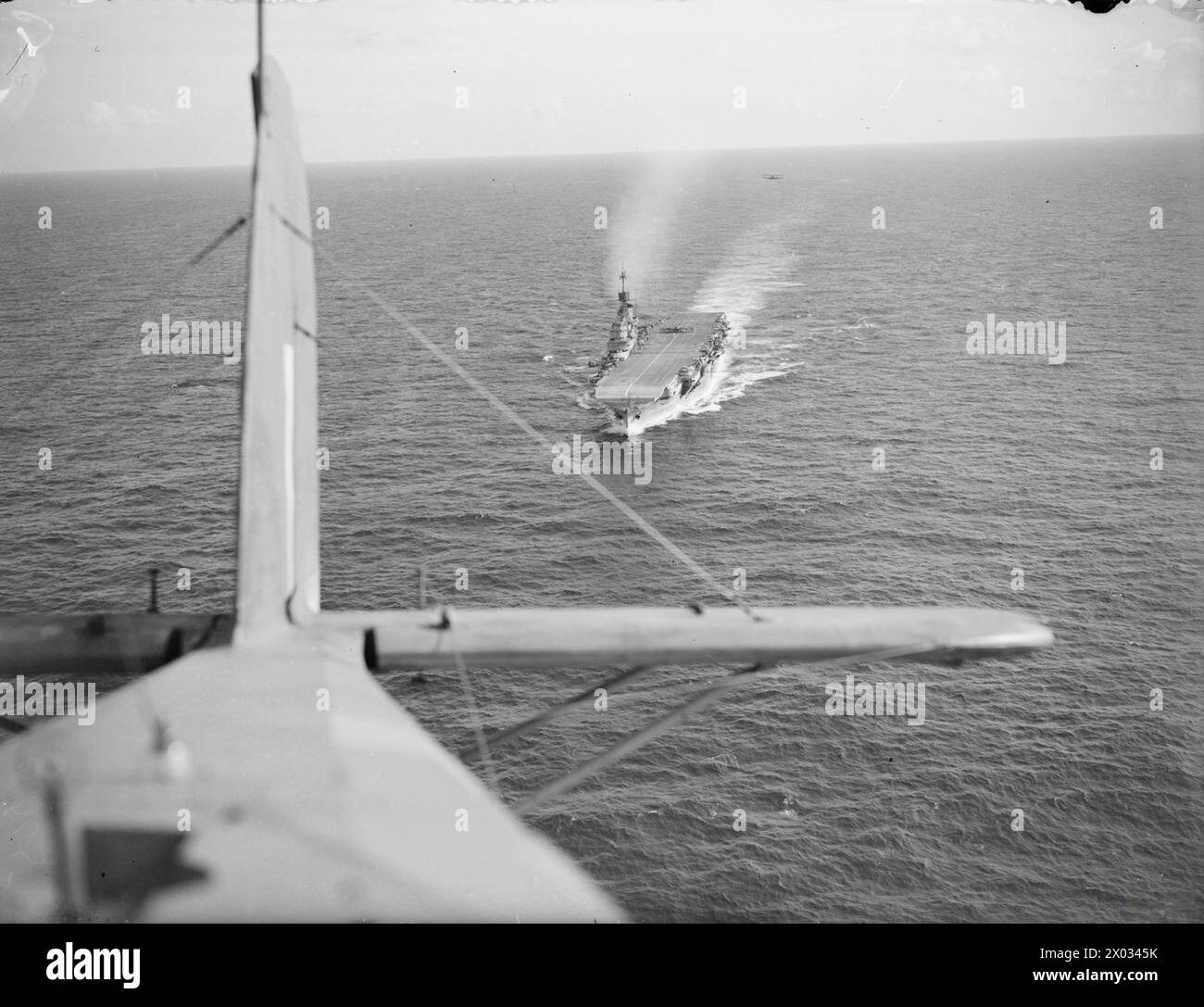 HMS INDOMITABLE. 16 JULY 1942. - A Sea-Hurrricane Mark II, can be seen ...