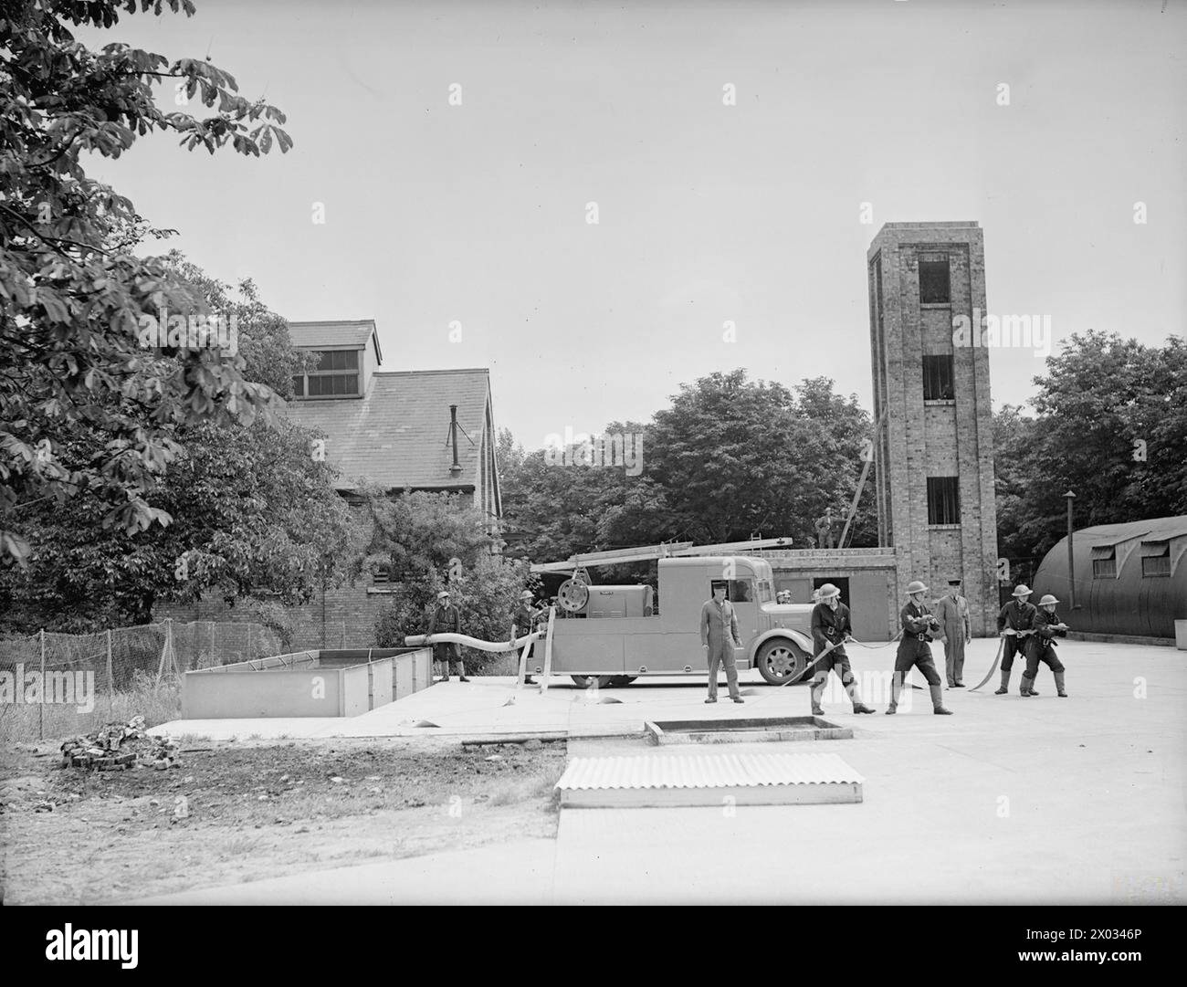 ROYAL NAVAL FIRE FIGHTERS GO THROUGH THEIR PACES. 25 JUNE 1943, CHATHAM ...