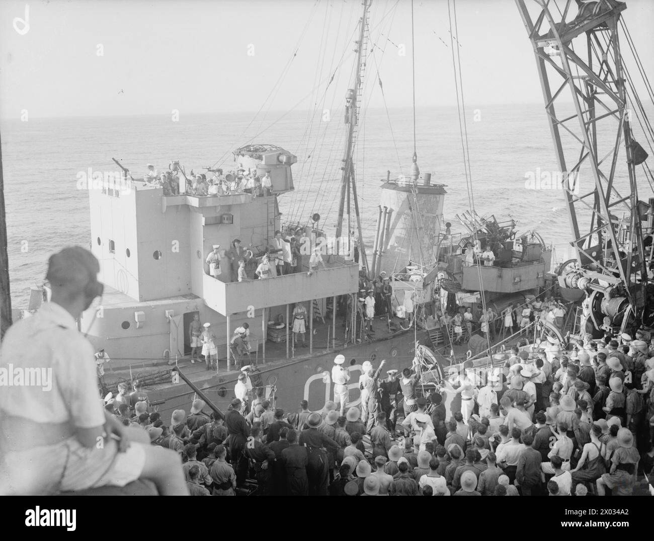 SOLDIERS TAKE PASSAGE IN THE CRUISER HMS MANCHESTER. JULY 1941, ON ...