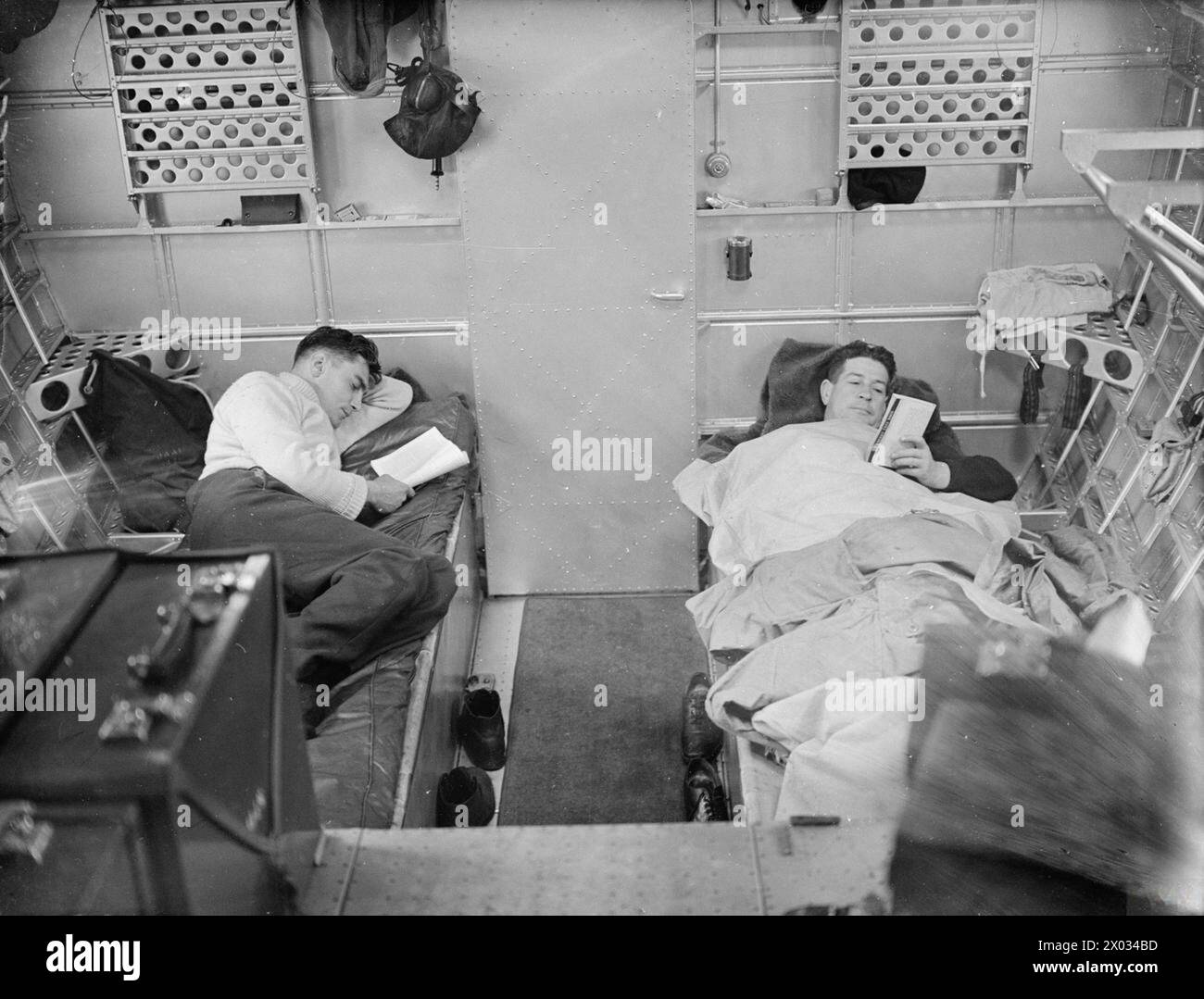 Off-duty aircrew of No. 10 Squadron RAAF relax in the aft sleeping ...
