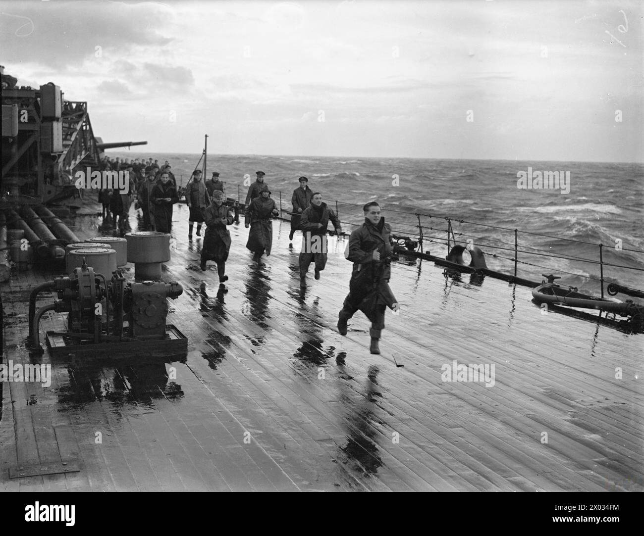 HMS Rodney deploys paravanes in 1940 as the battleship enters a mined ...