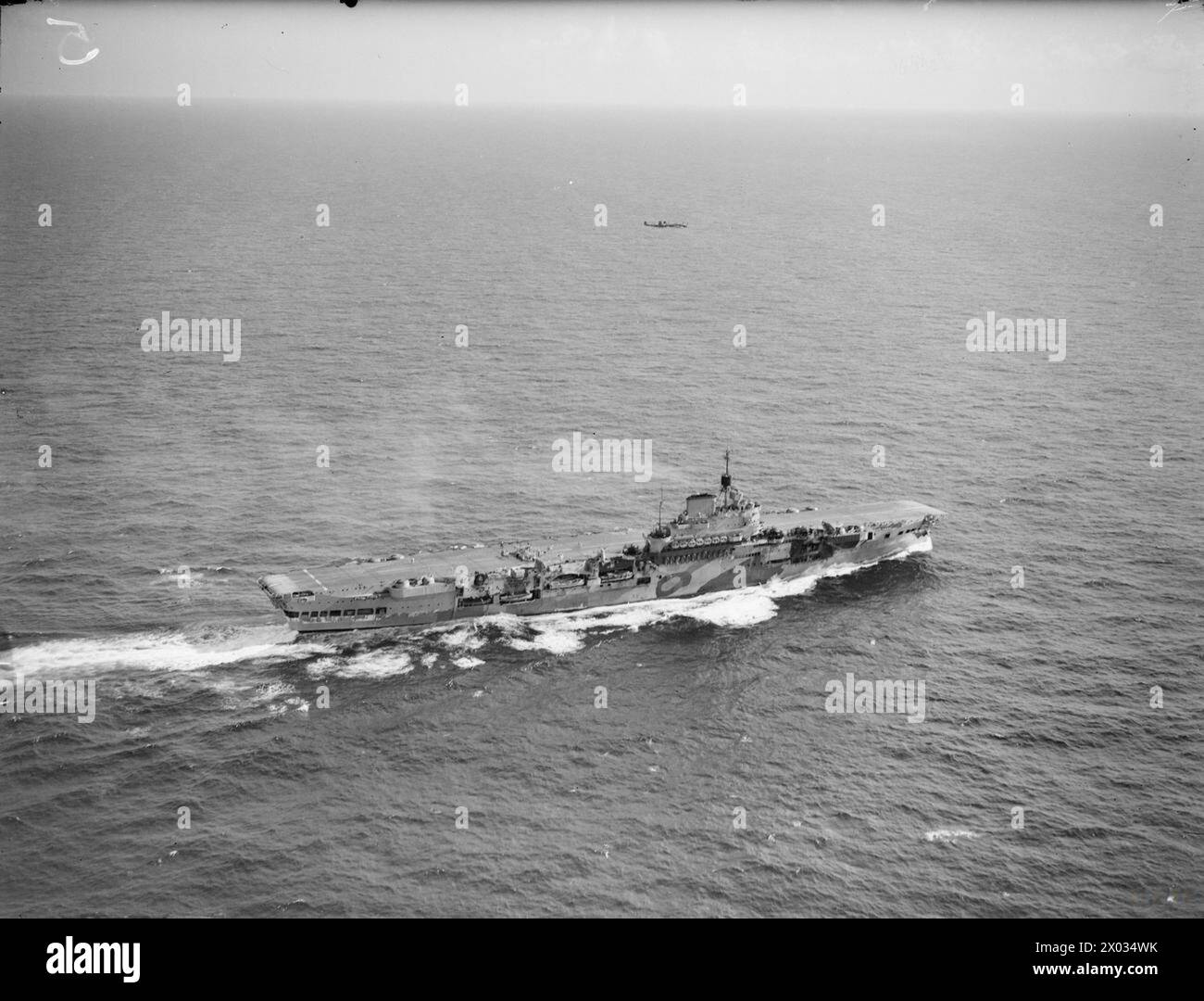HMS INDOMITABLE. 16 JULY 1942. - HMS INDOMITABLE seen from the air ...