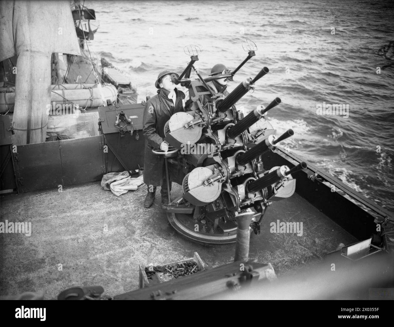 Crew aboard HMS Vanity operate a 0.5-inch Vickers water-cooled machine ...
