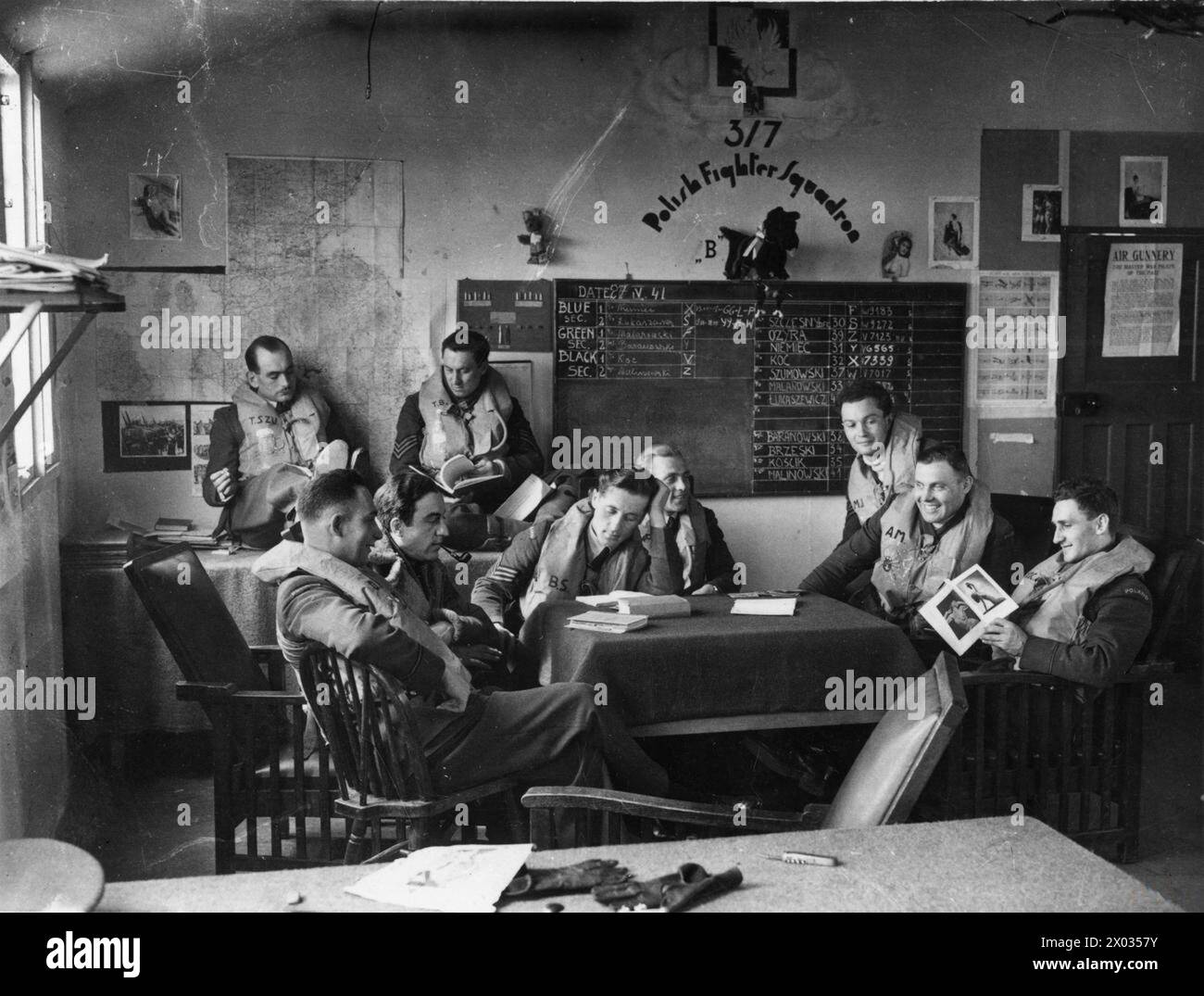 Pilots and personnel of No. 317 Polish Fighter Squadron take a break in ...