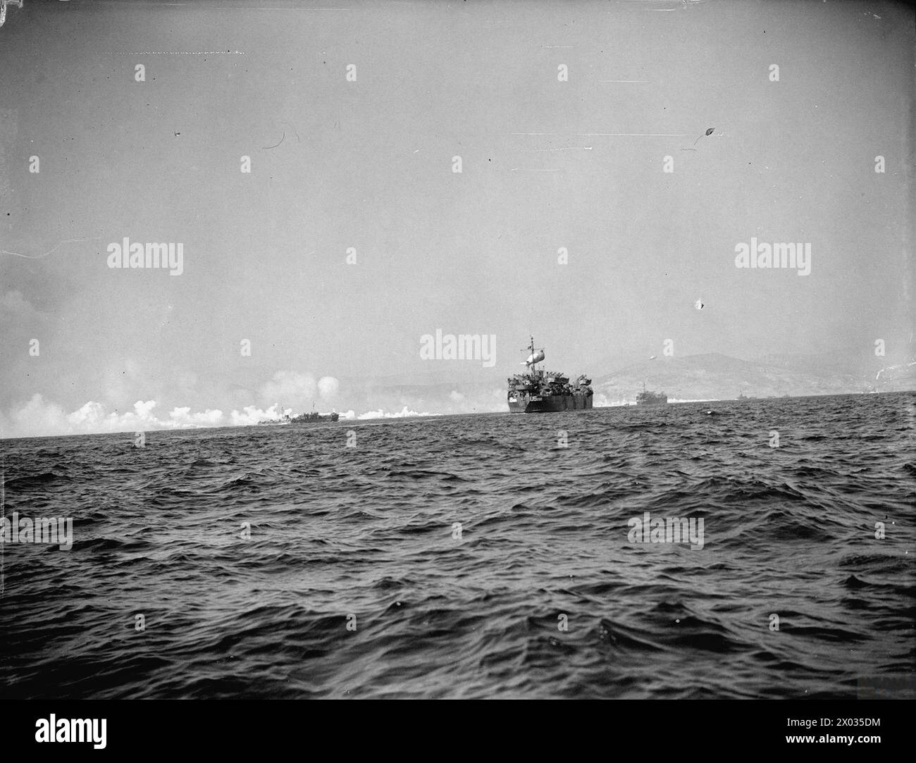 Landing Ship Tanks are shown proceeding to the beaches during the ...