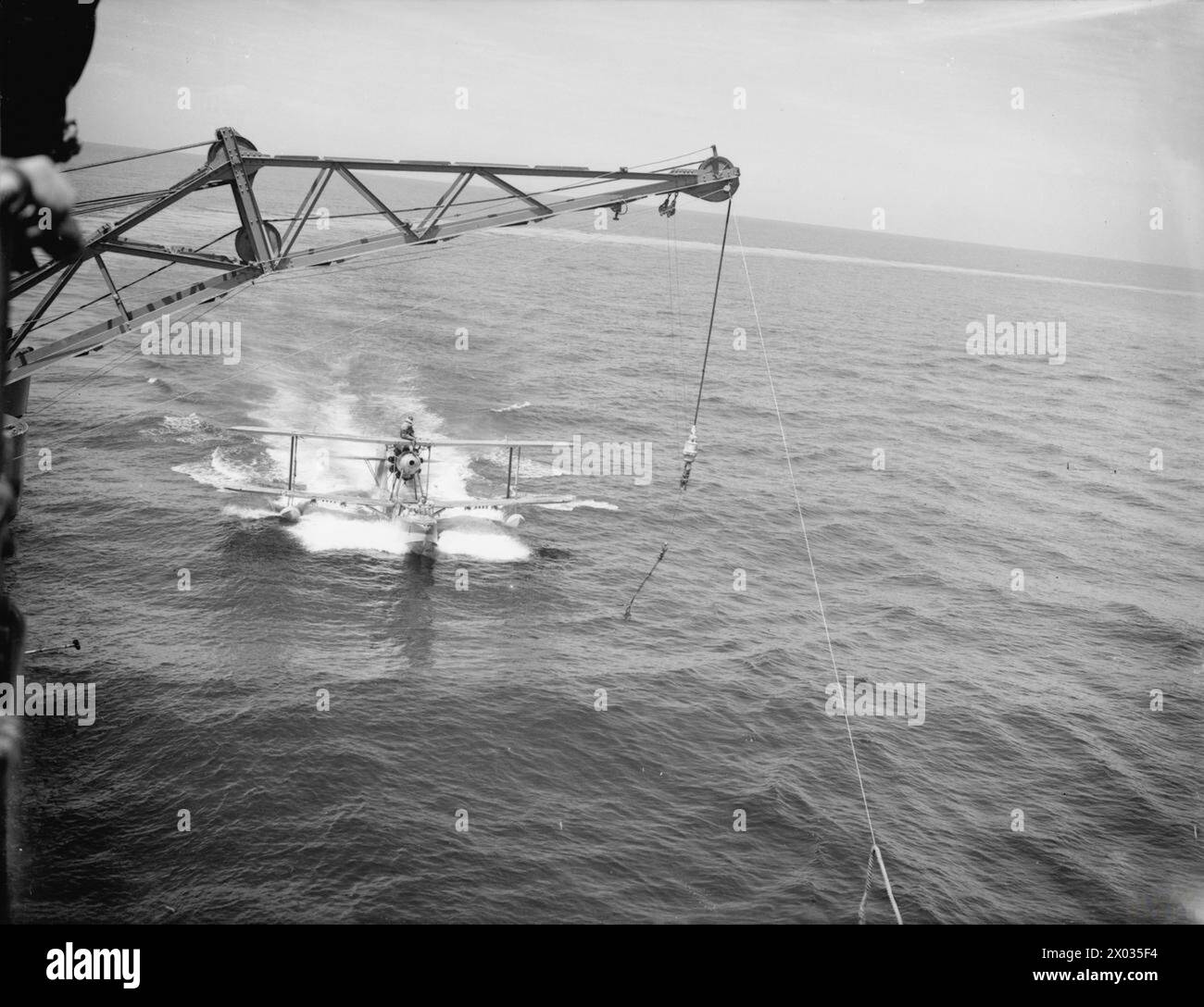 ON BOARD THE CRUISER HMS SHEFFIELD. MAY 1941, AT SEA. - A Supermarine Walrus Amphibian taxi-ing ...