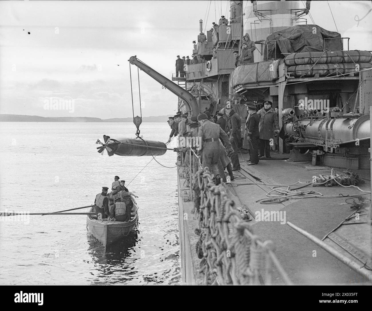 The Polish destroyer ORP Piorun retrieves a practice torpedo in the ...