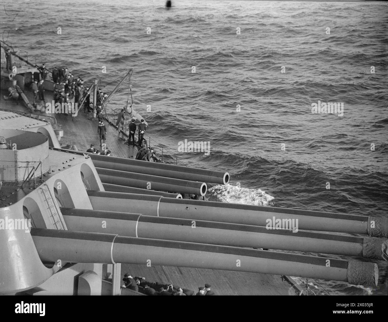 ON BOARD THE BATTLESHIP HMS RODNEY AT SEA. 1940. - Busy scene on the ...