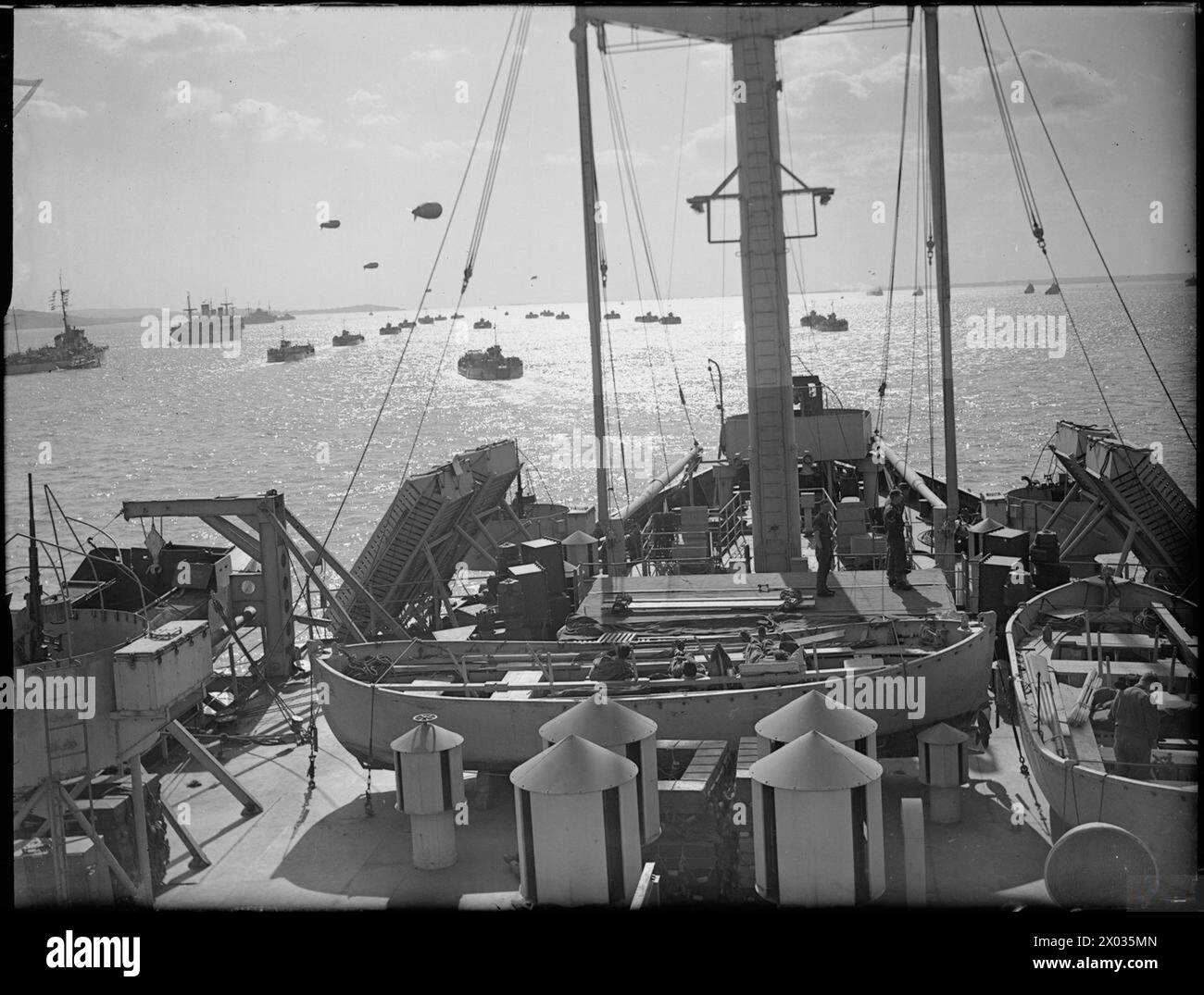Landing craft carry tanks to the beaches during pre-invasion fleet ...