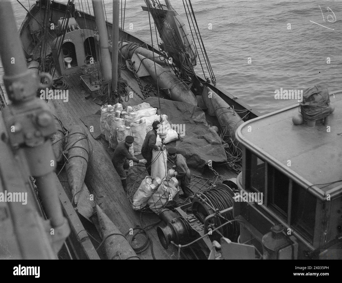 THE DAILY ROUTINE OF HMS TYNE, A DESTROYER DEPOT SHIP. FLEET ANCHORAGE ...