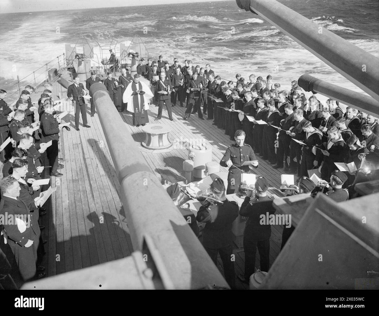 Officers and men of the Fiji-class cruiser HMS Mauritius attend Divine ...