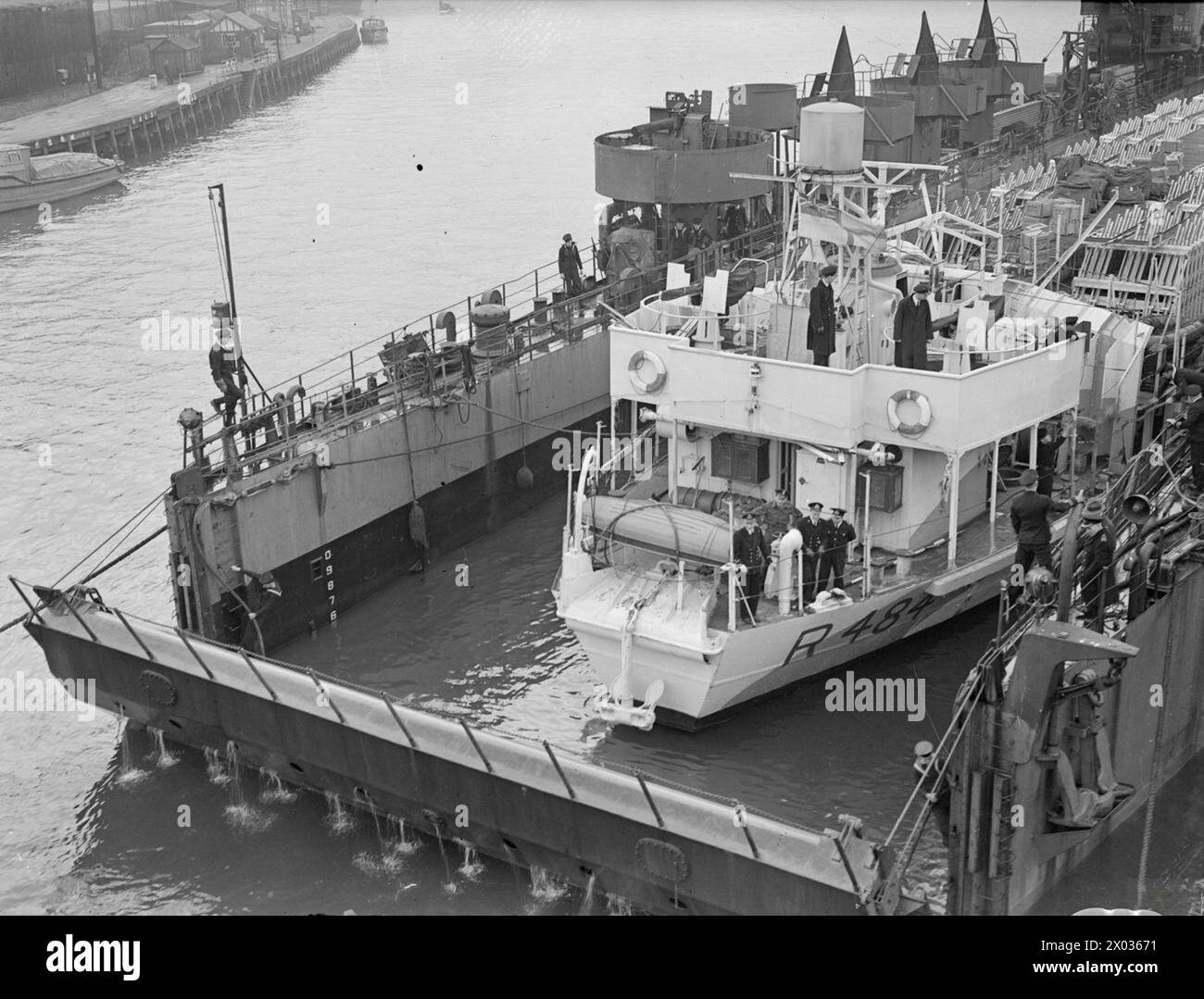 LANDING SHIP (DOCK) LOADS LANDING CRAFT (ROCKET). 13 DECEMBER 1944 ...