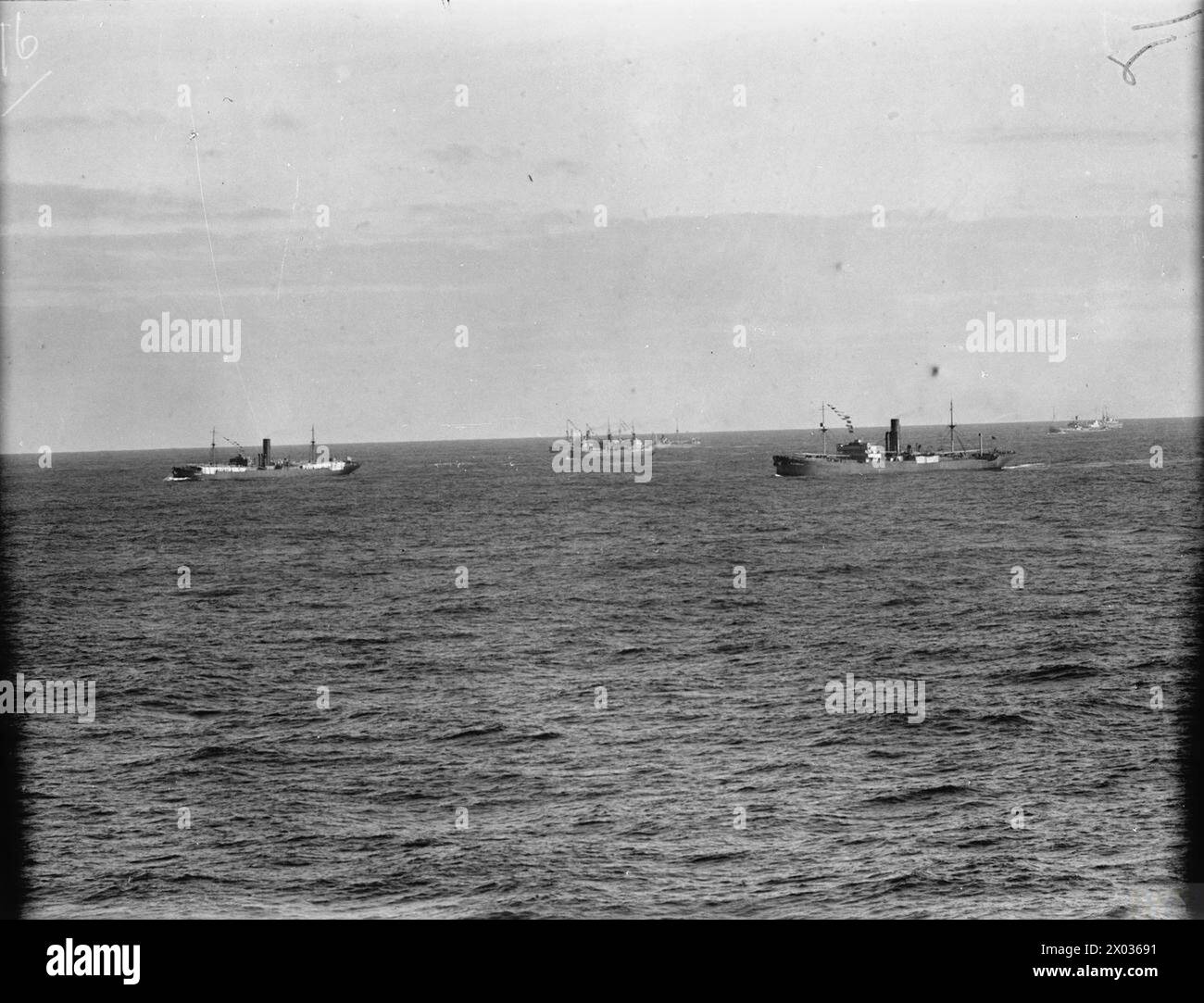 ON BOARD THE BATTLESHIP HMS RODNEY AT SEA. 1940. - Some of the convoy ...