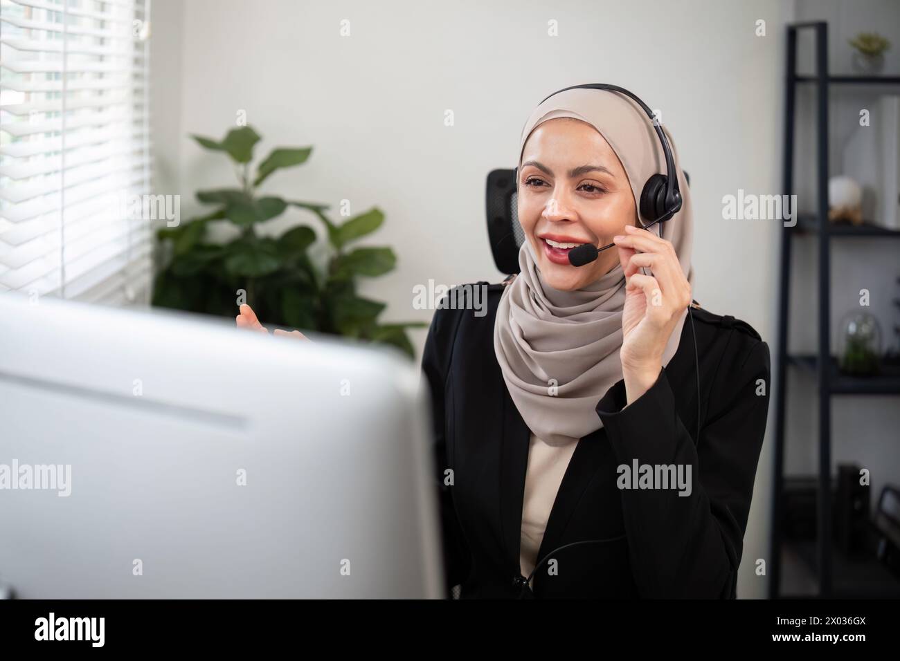 Young muslim women wearing hijab telemarketing or call center agent ...