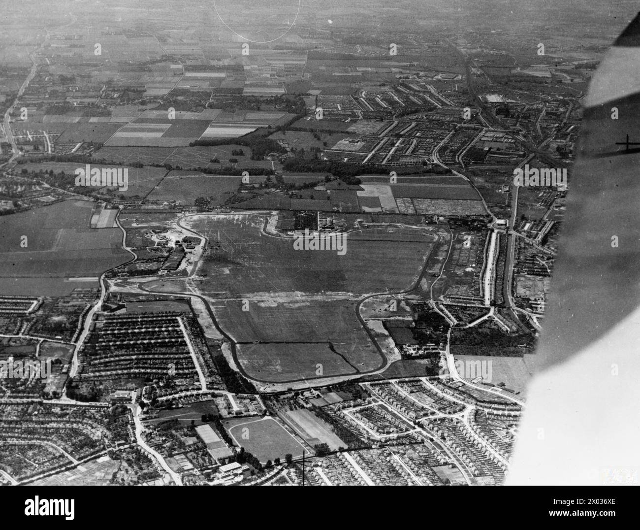 Aerial views of Heston Aerodrome in England during 1941–1942, showing ...