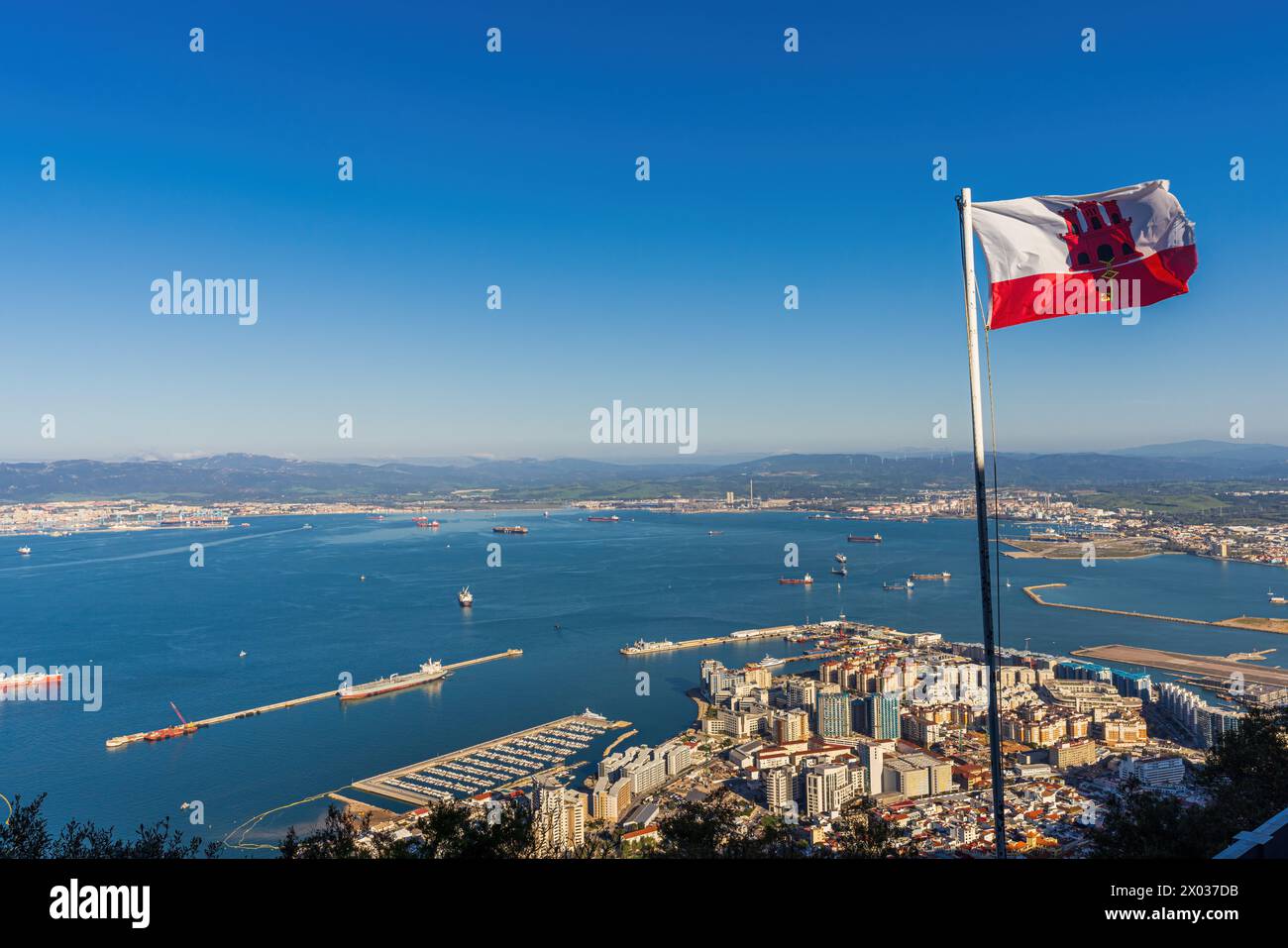 A pnaorama of Gibraltar city with Gibraltar's flag Stock Photo - Alamy