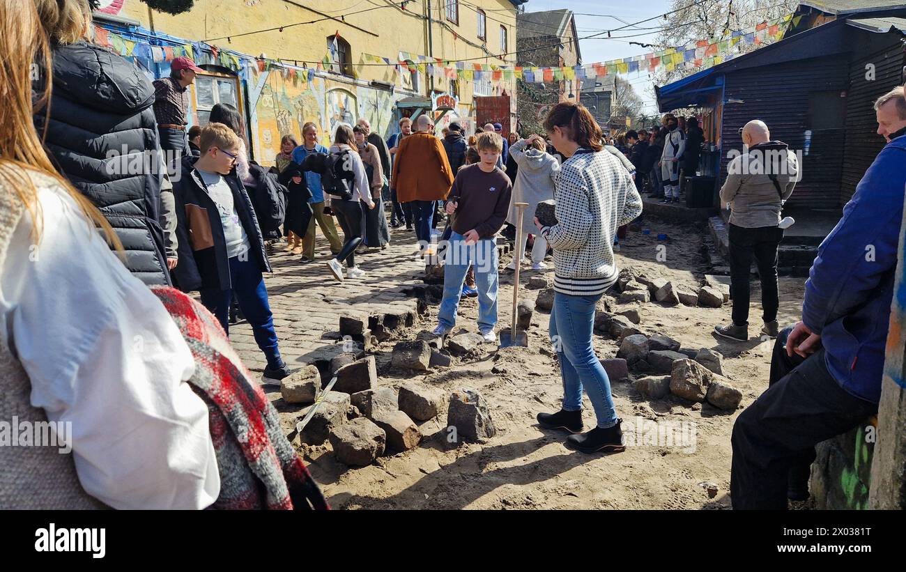 Copenhagen, Denmark - 06 Apr 2024: People are digging up cobblestones ...