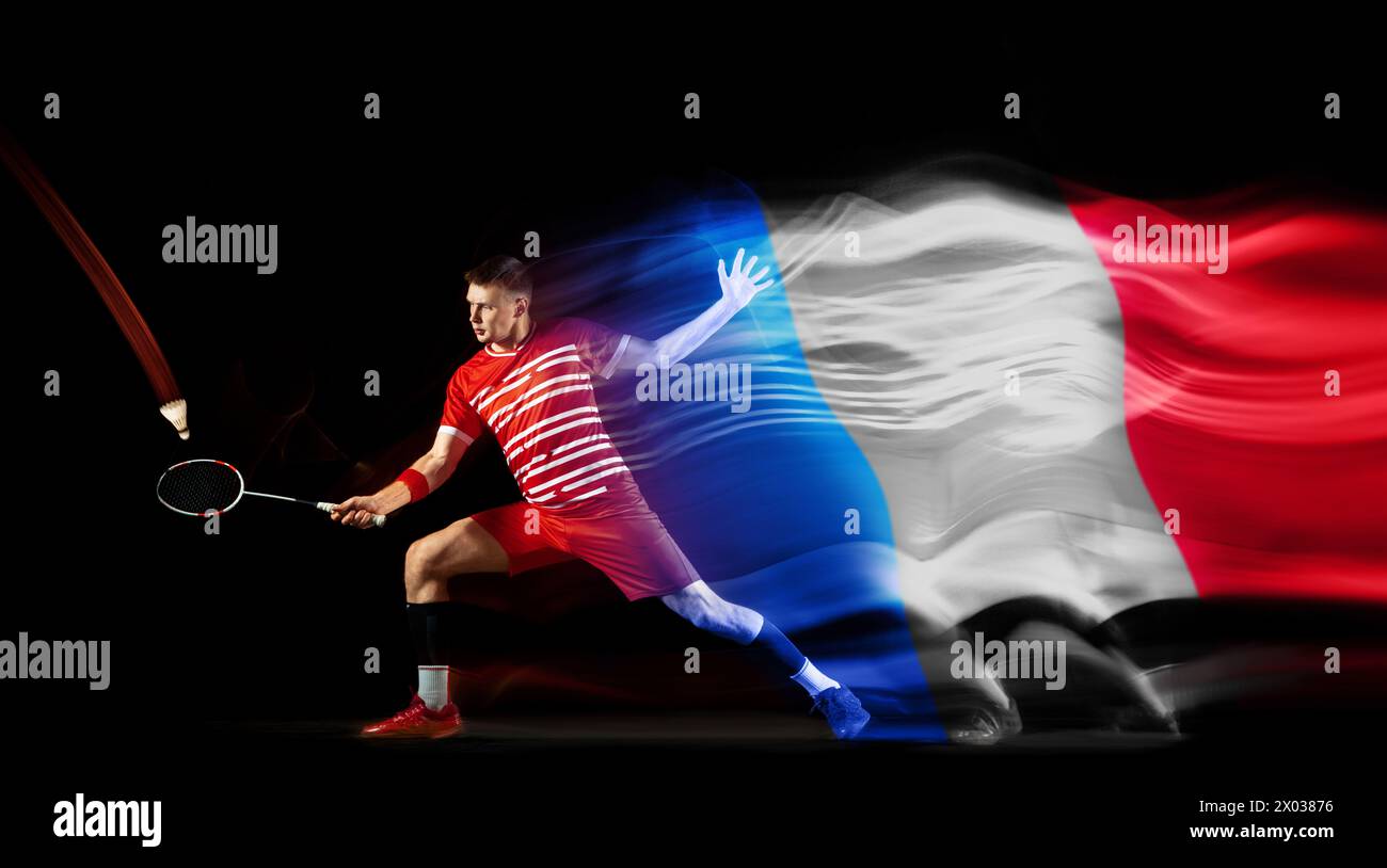 Male badminton athlete in motion with the racket, playing on black ...